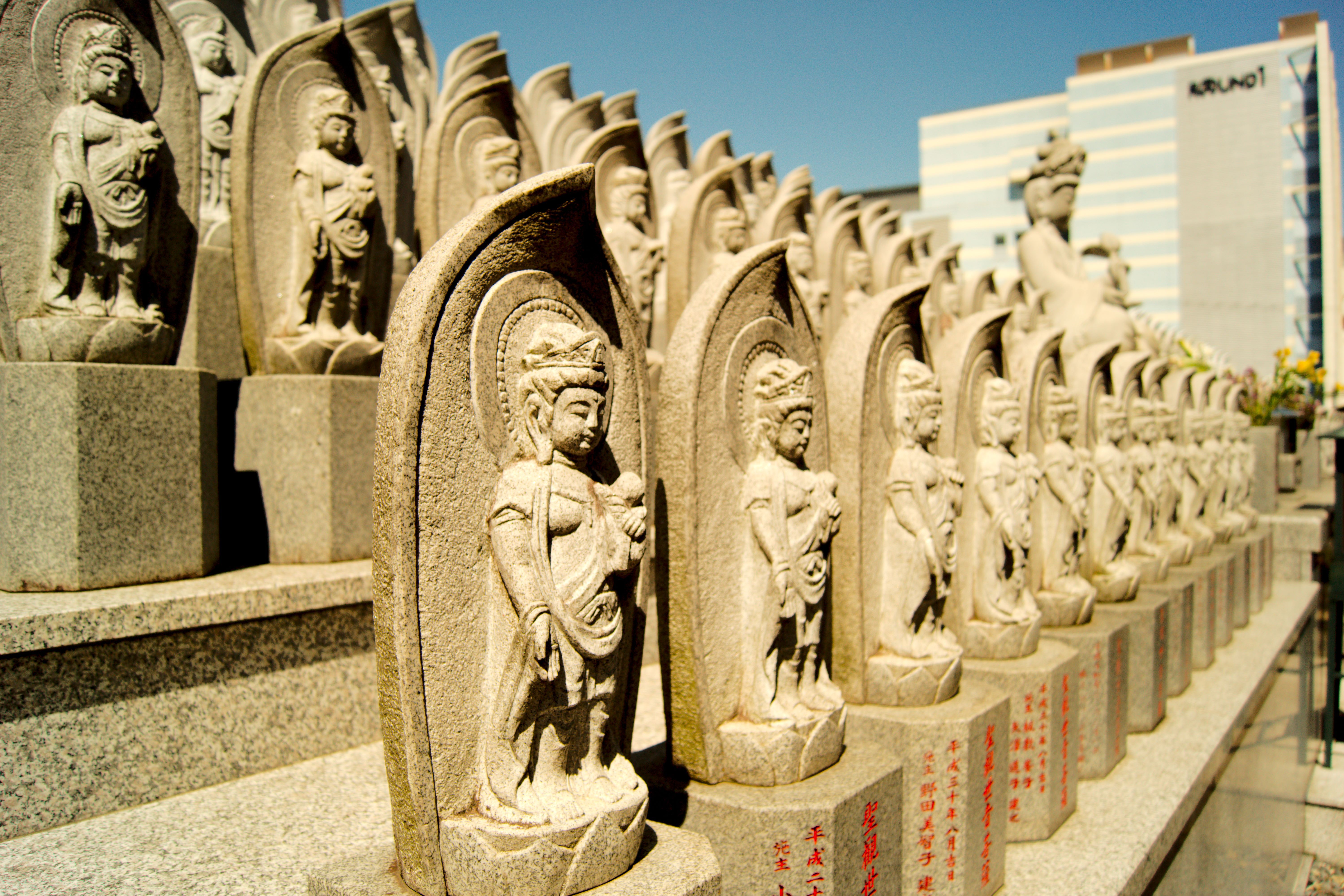 Buddhist Stone Statues in Tokyo Temple Setting · Free Stock Photo