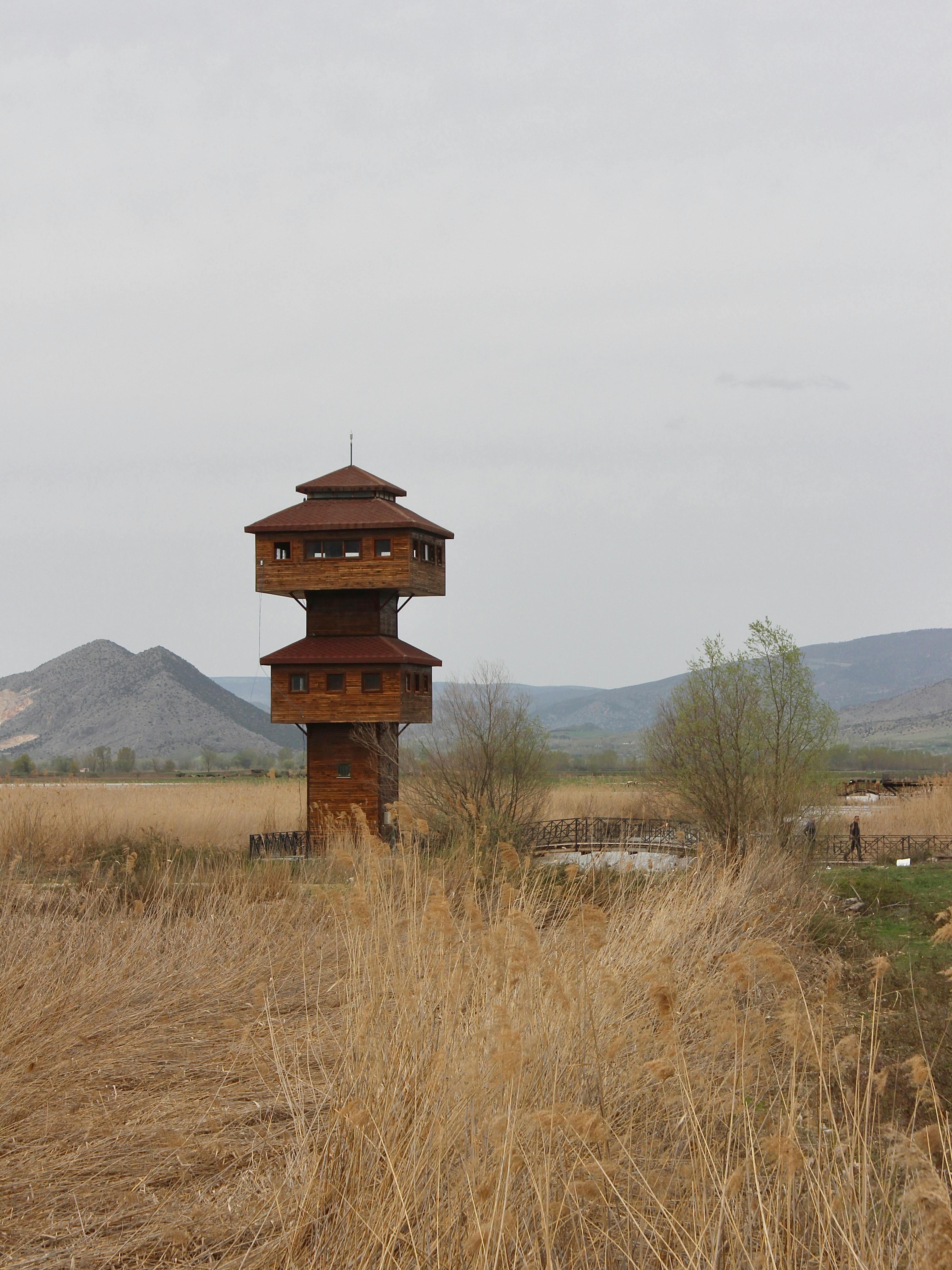 Rustic Watchtower in Serene Countryside Landscape · Free Stock Photo