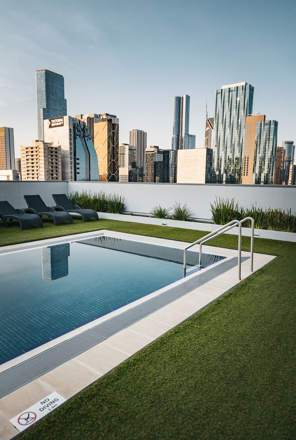 Modern Rooftop Pool Overlooking City Skyline · Free Stock Photo