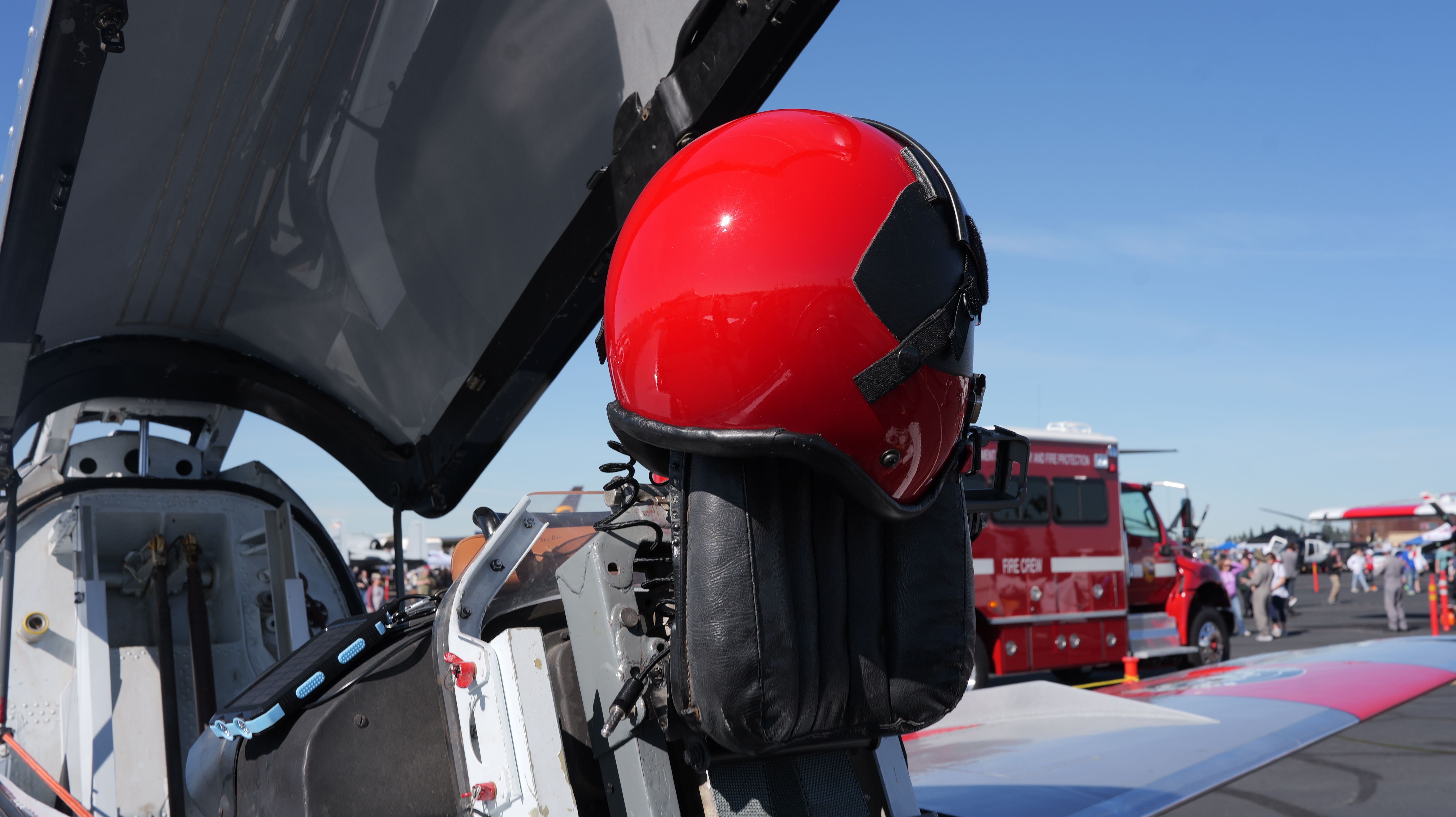 Red Pilot Helmet on Fighter Jet Cockpit at Airshow · Free Stock Photo