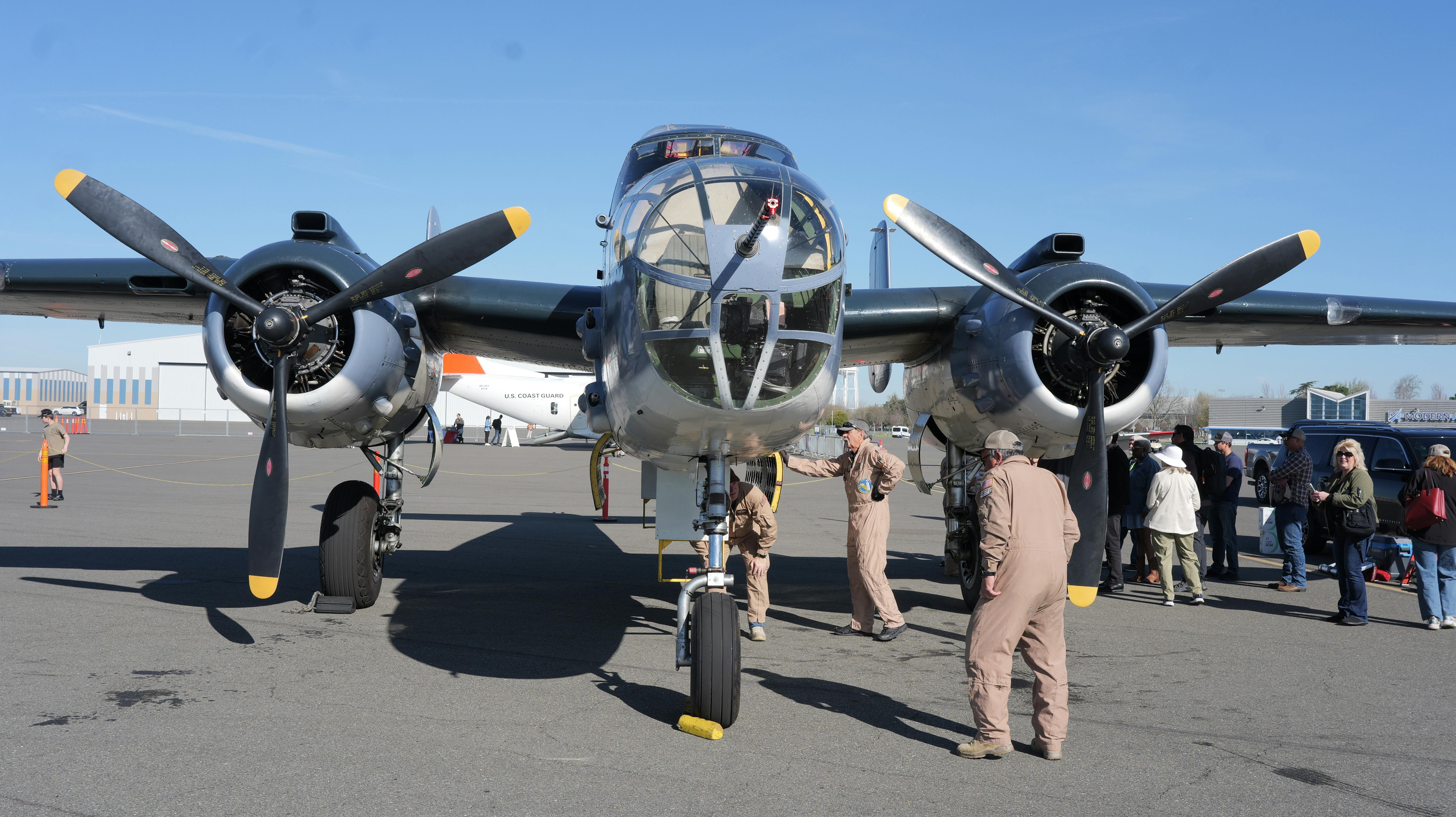 Vintage Aircraft on Display with Crew and Visitors · Free Stock Photo