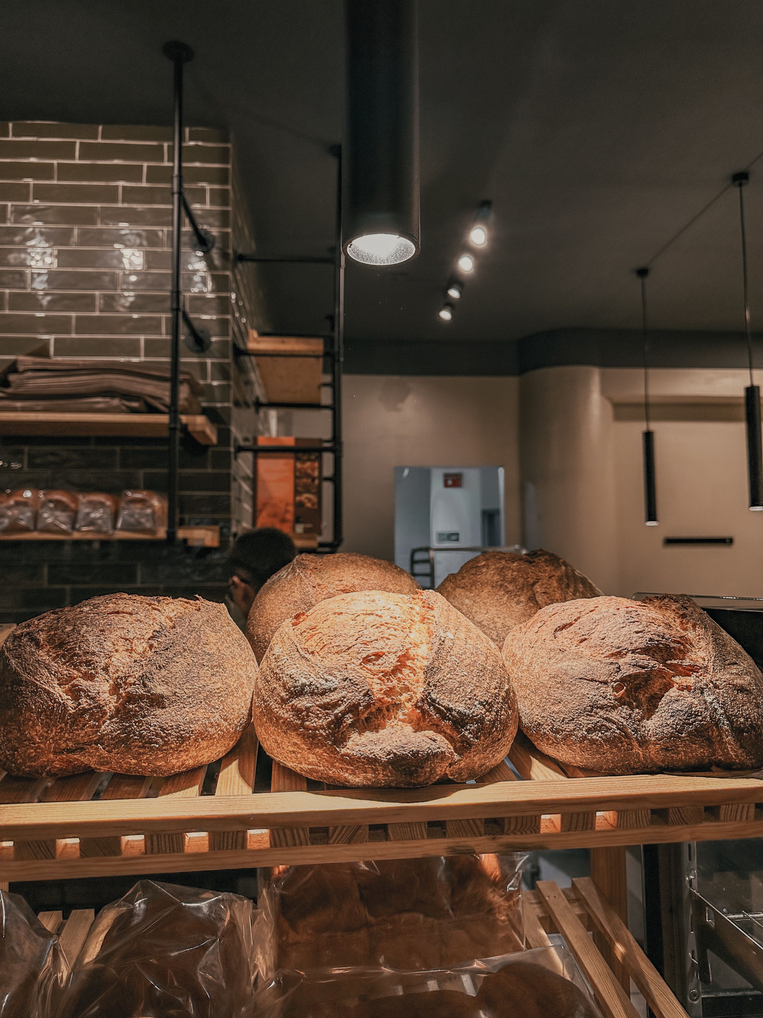 Freshly Baked Artisan Bread in Cozy Bakery · Free Stock Photo