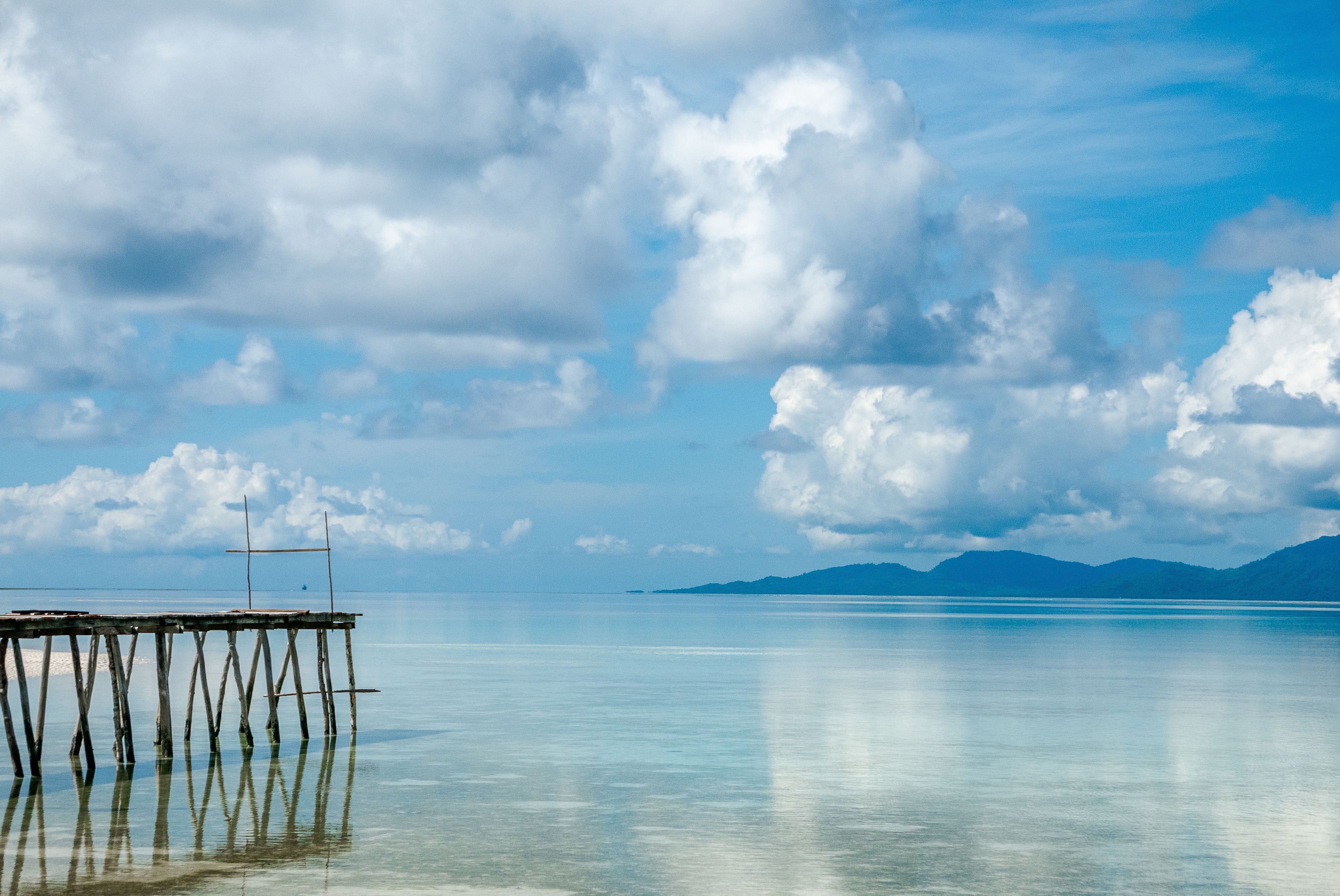 Tranquil Blue Seascape with Wooden Pier · Free Stock Photo