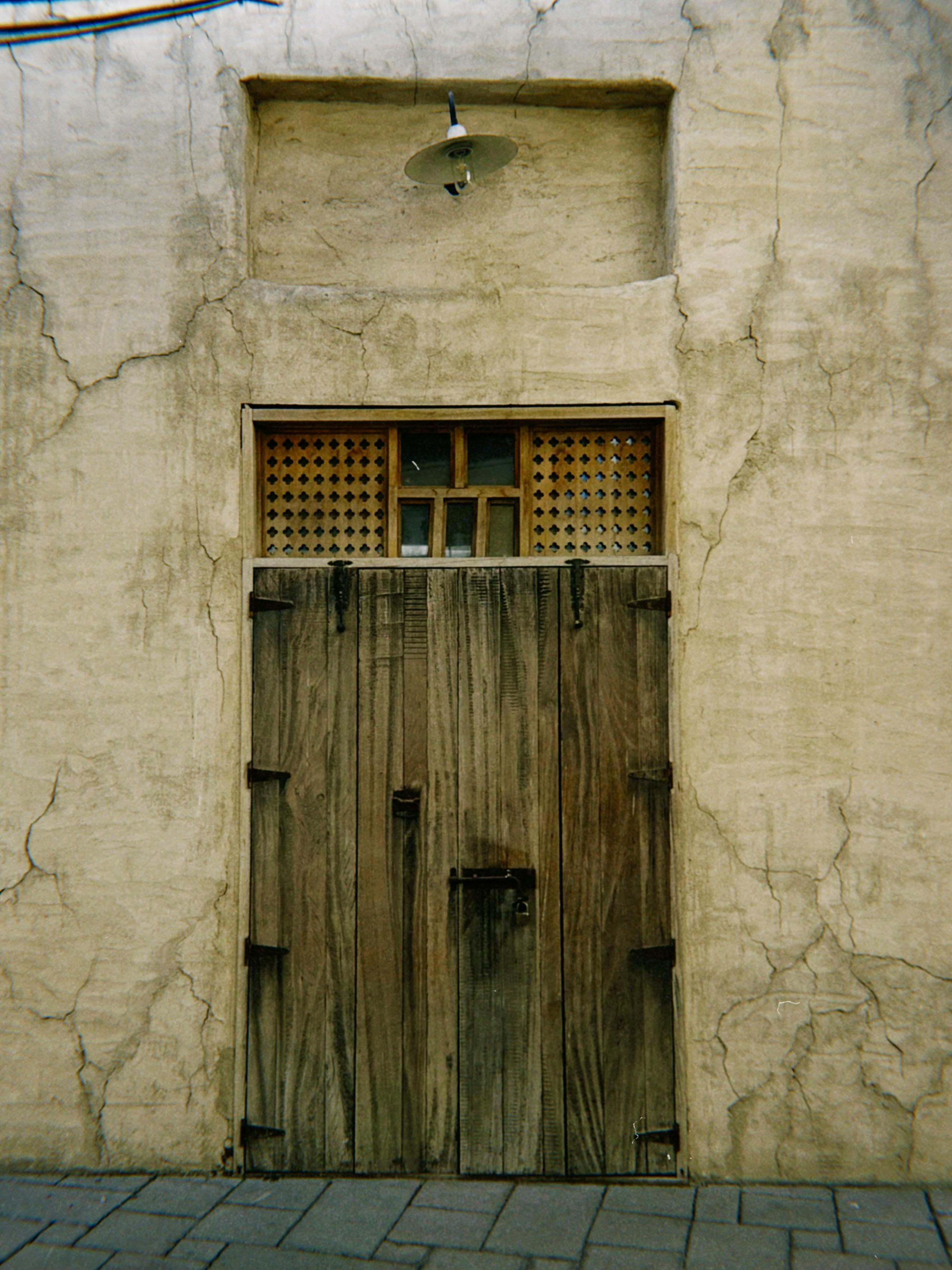 Traditional Wooden Door in Historic Dubai Souq · Free Stock Photo