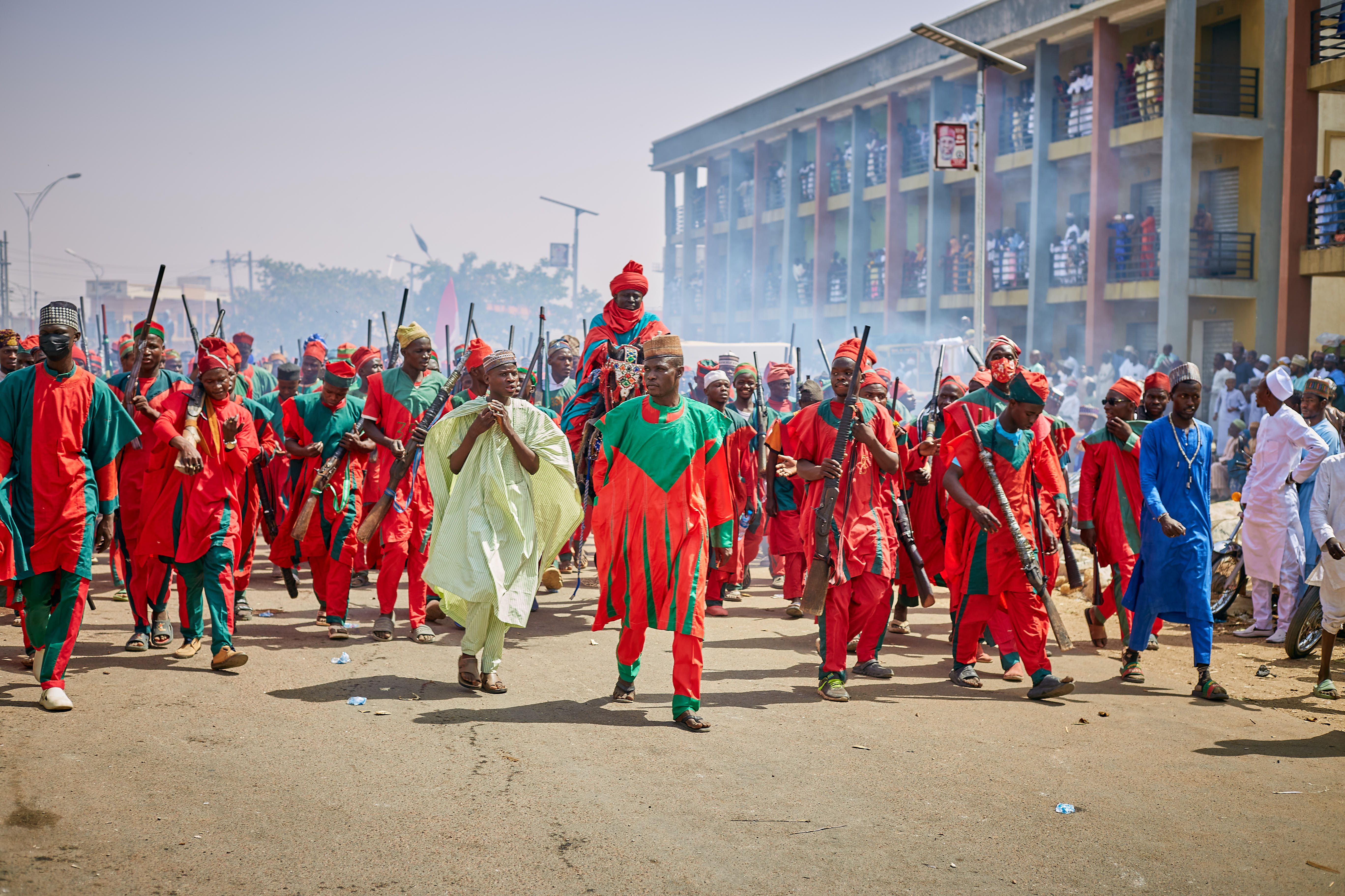 Colorful Cultural Parade in Nigerian City Street · Free Stock Photo