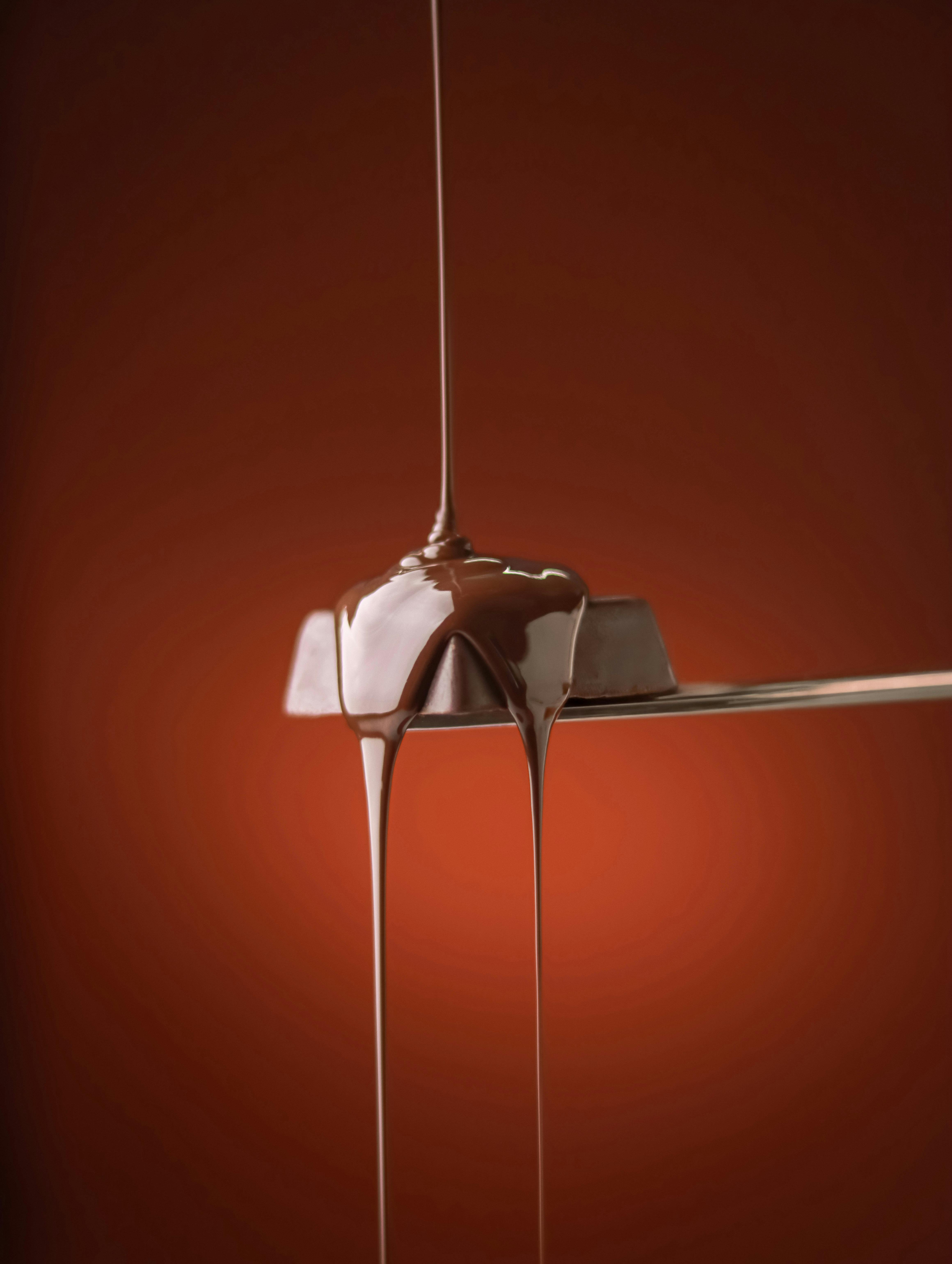 Rich Dark Chocolate Dripping on Spoon · Free Stock Photo