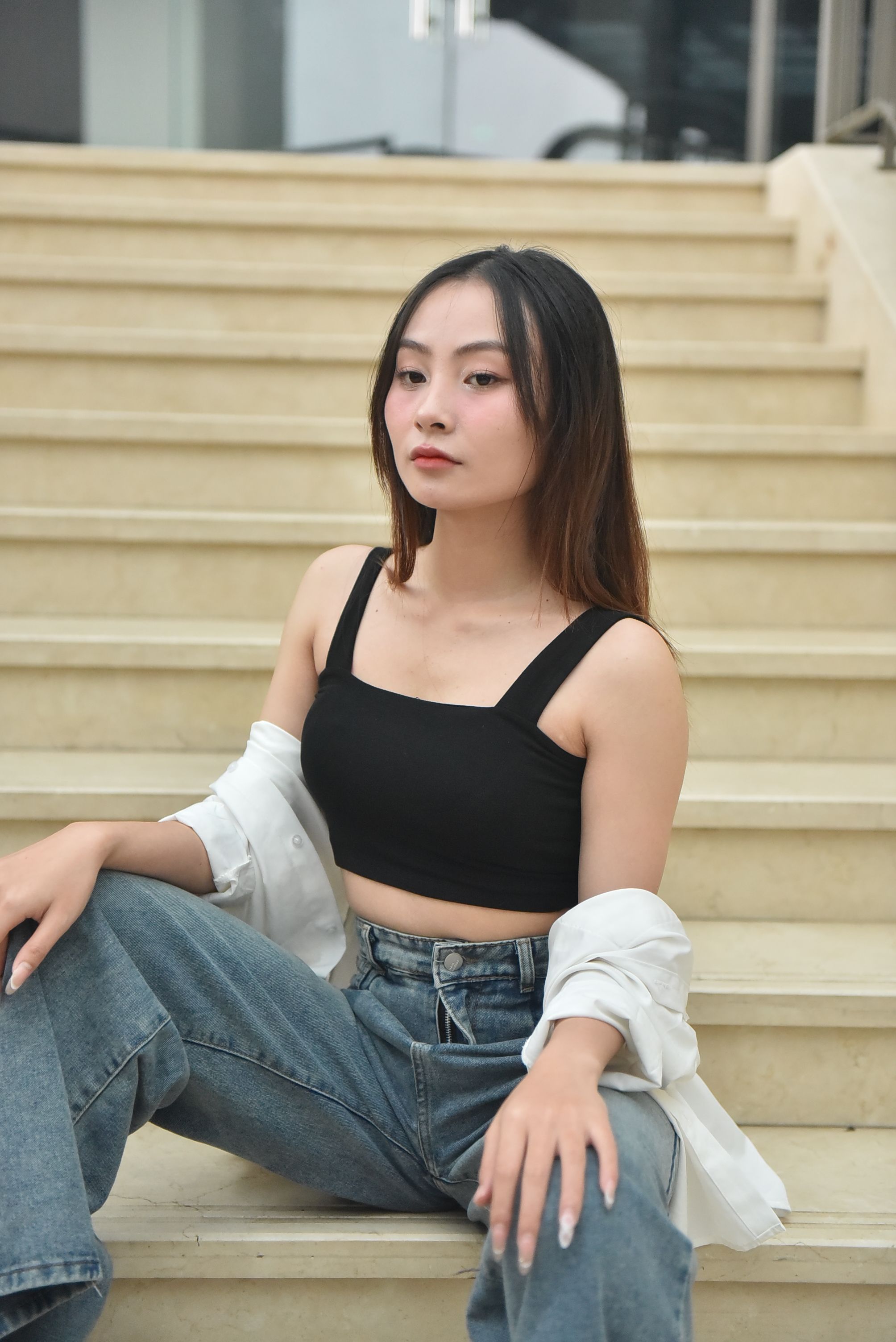 Casual Portrait of Young Woman on Stairs · Free Stock Photo