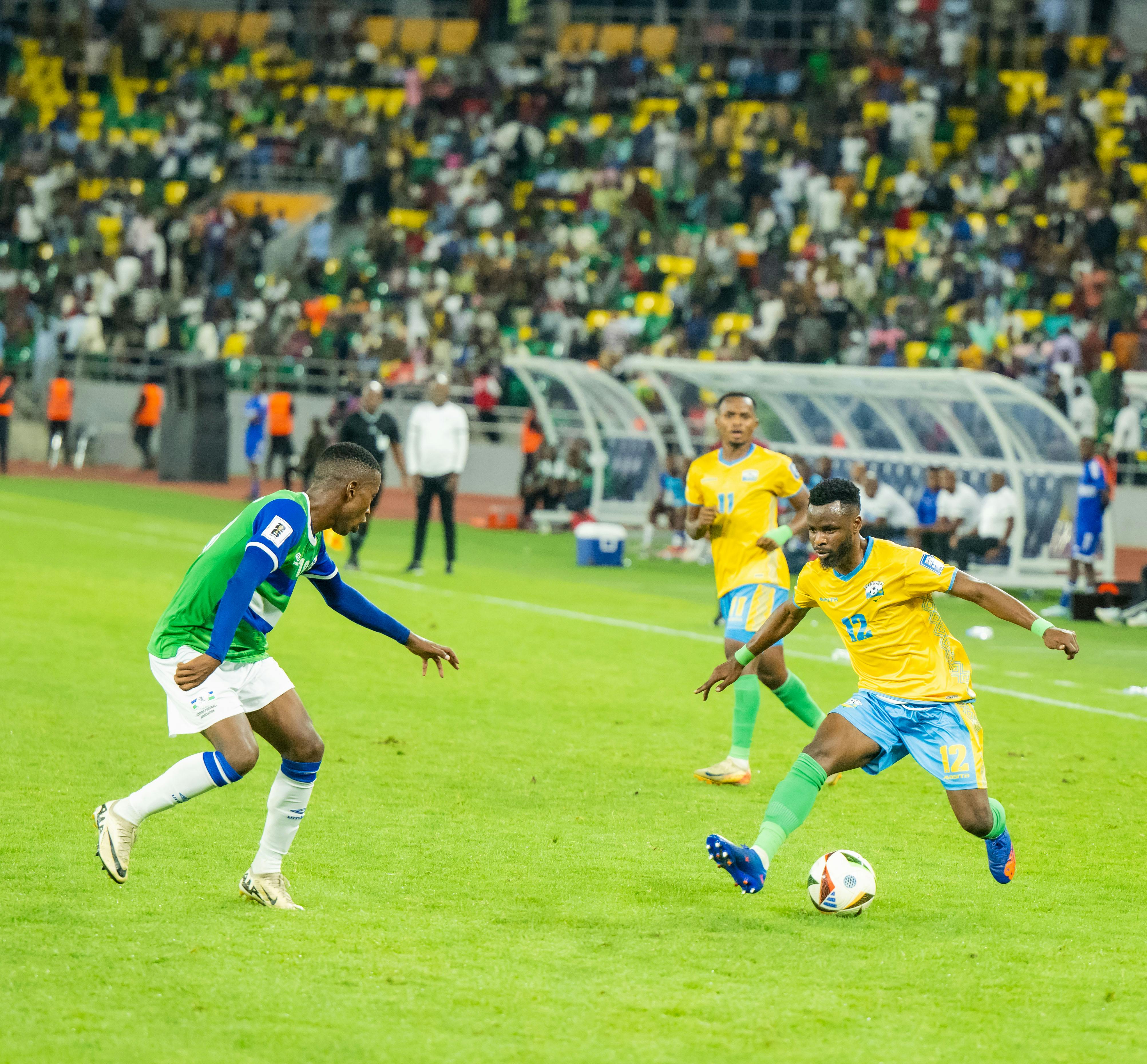 Intense Football Match at Kigali Stadium · Free Stock Photo