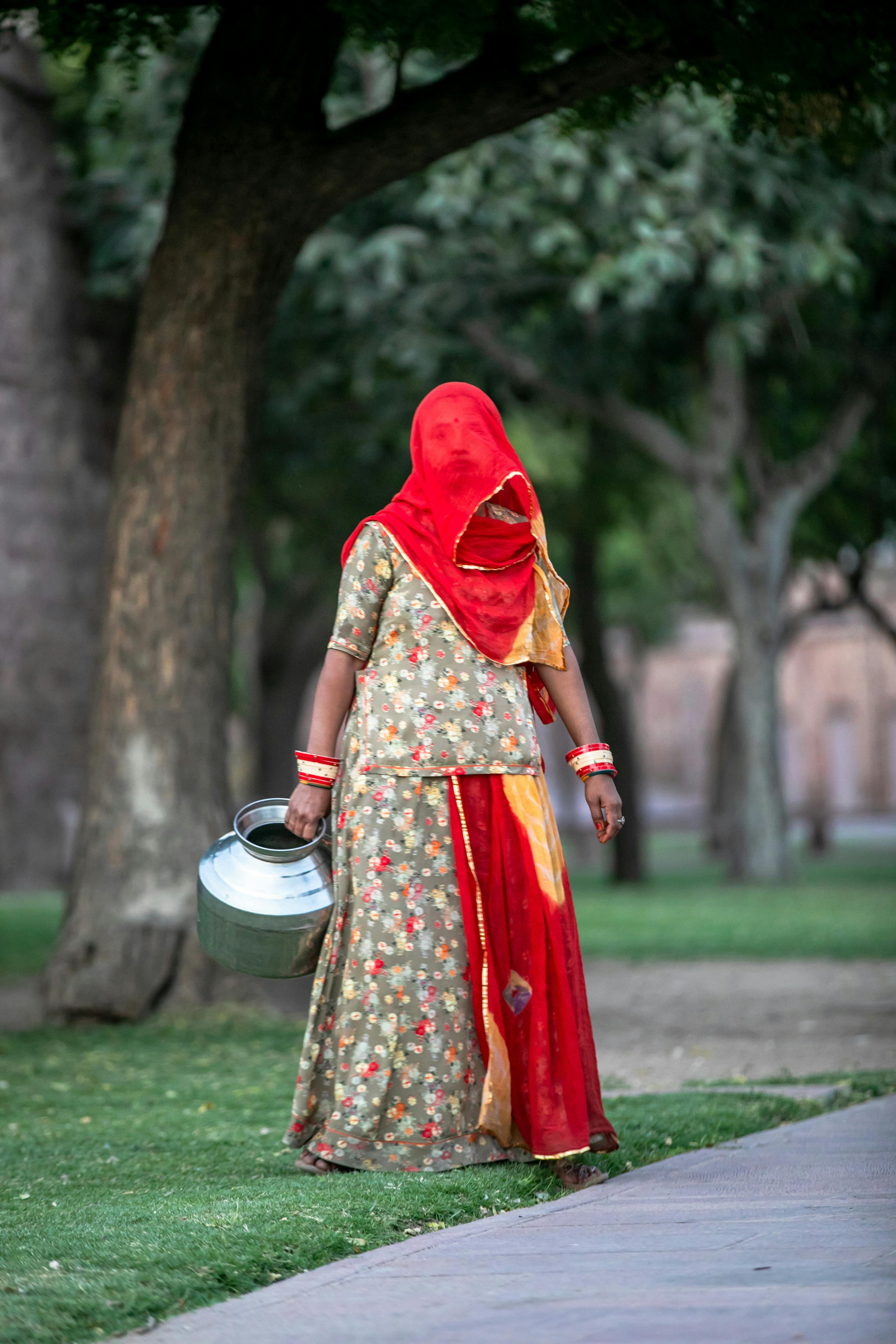 Traditional Woman in Colorful Indian Garb Outdoors · Free Stock Photo