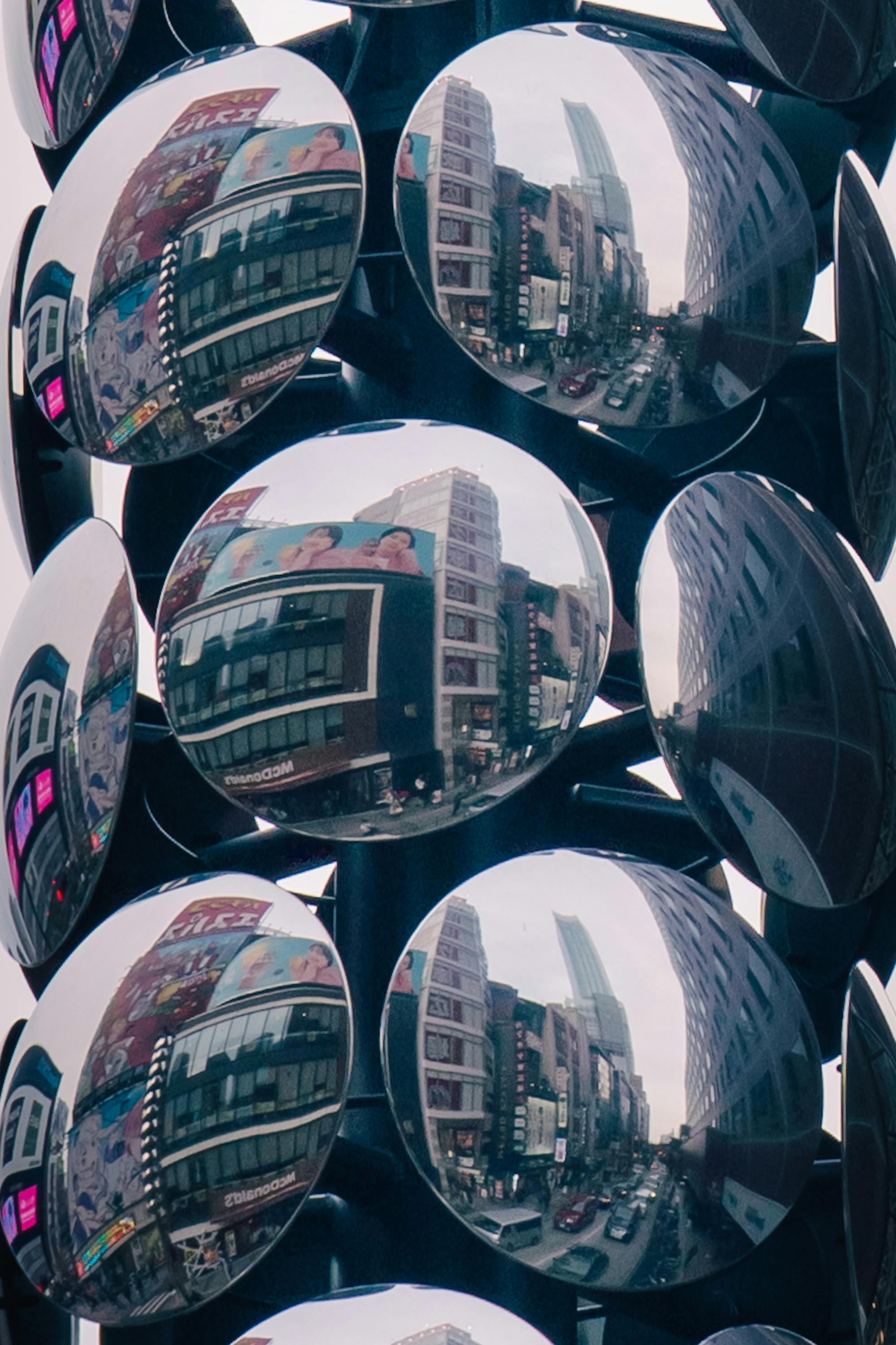 Urban Building Reflections in Spherical Mirrors · Free Stock Photo