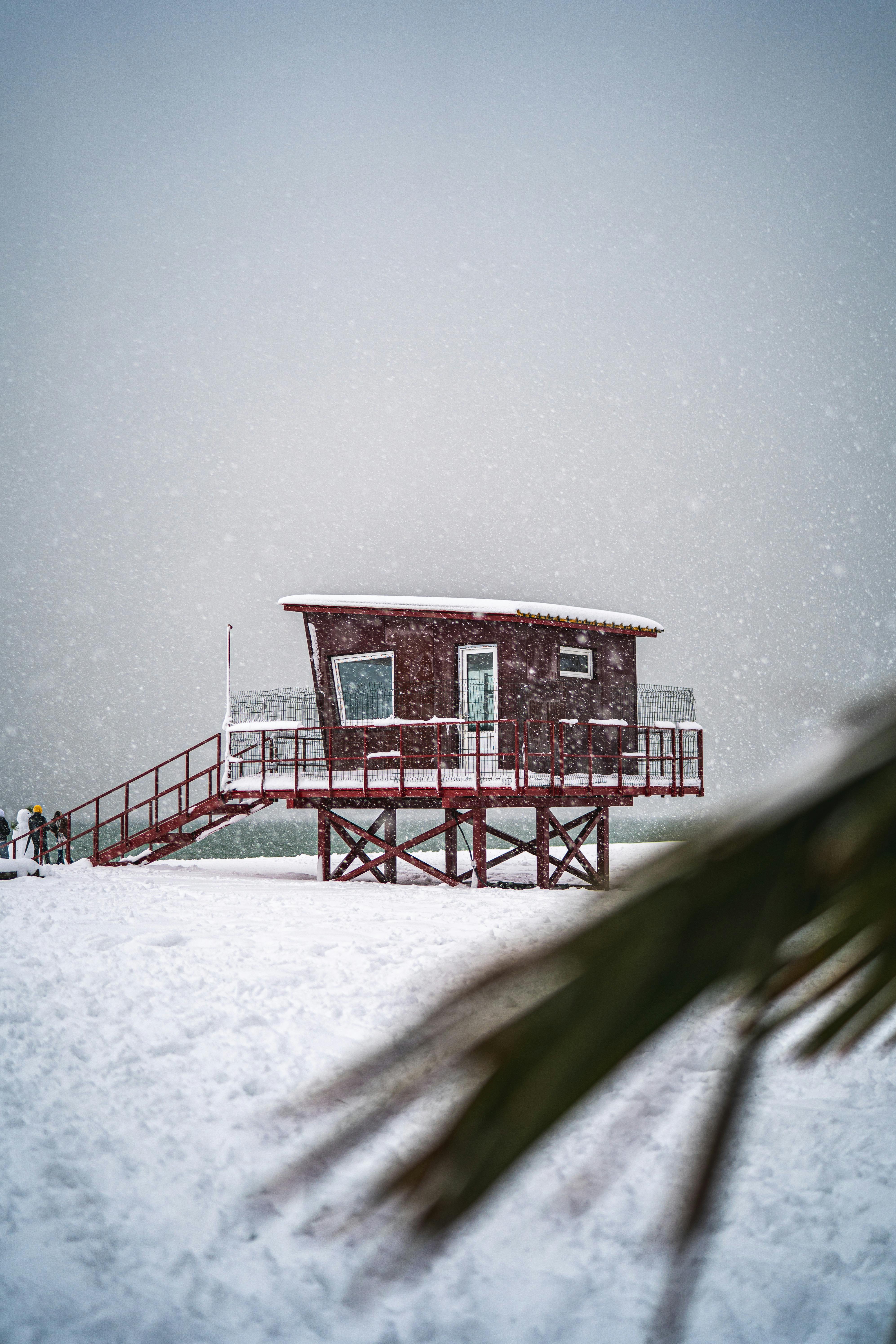 Snowy Lifeguard Station on Winter Beach · Free Stock Photo