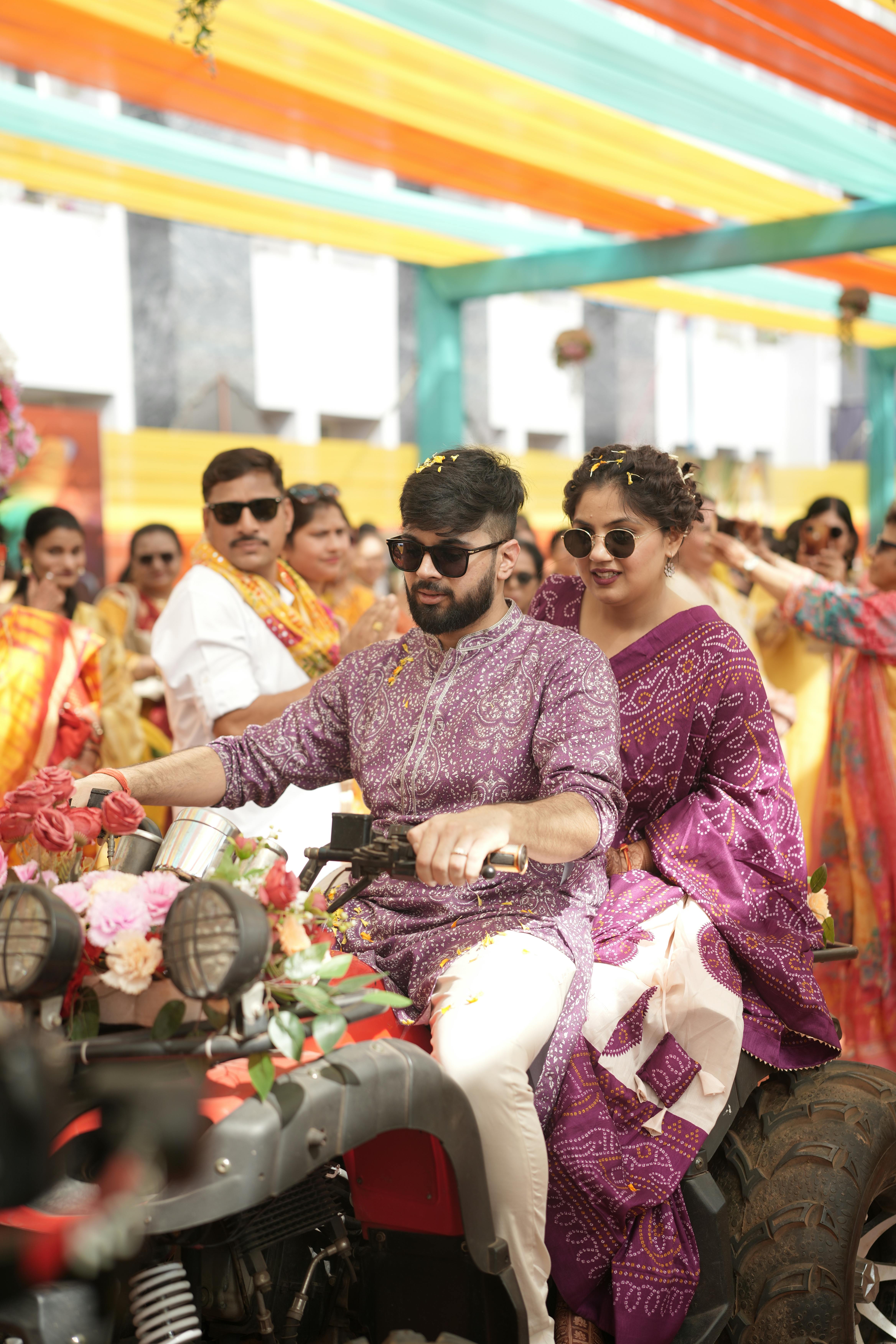 Colorful Haldi Ceremony with Bride and Groom on Bike · Free Stock Photo