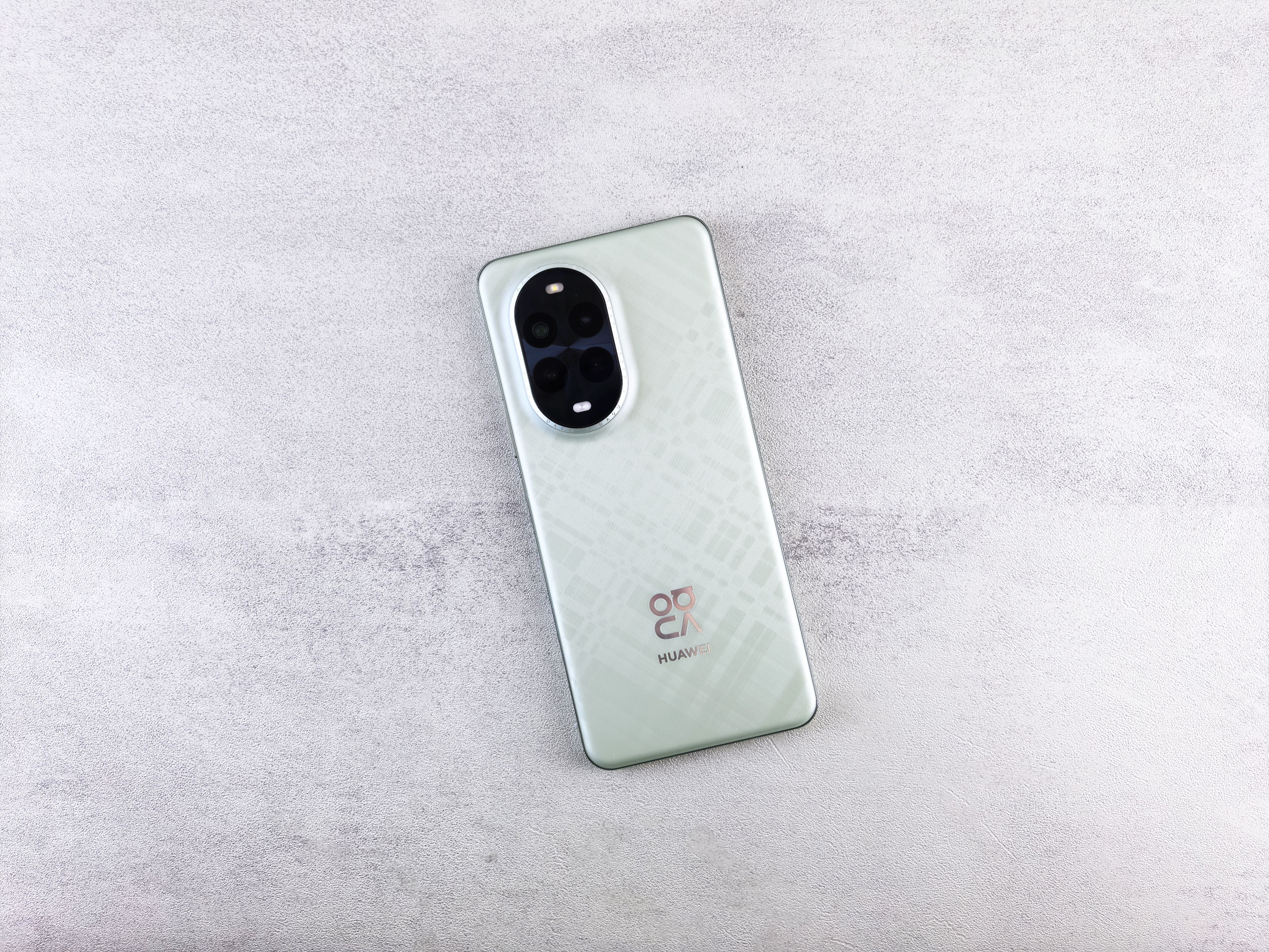 Minimalist Smartphone Flat Lay on Textured Surface · Free Stock Photo