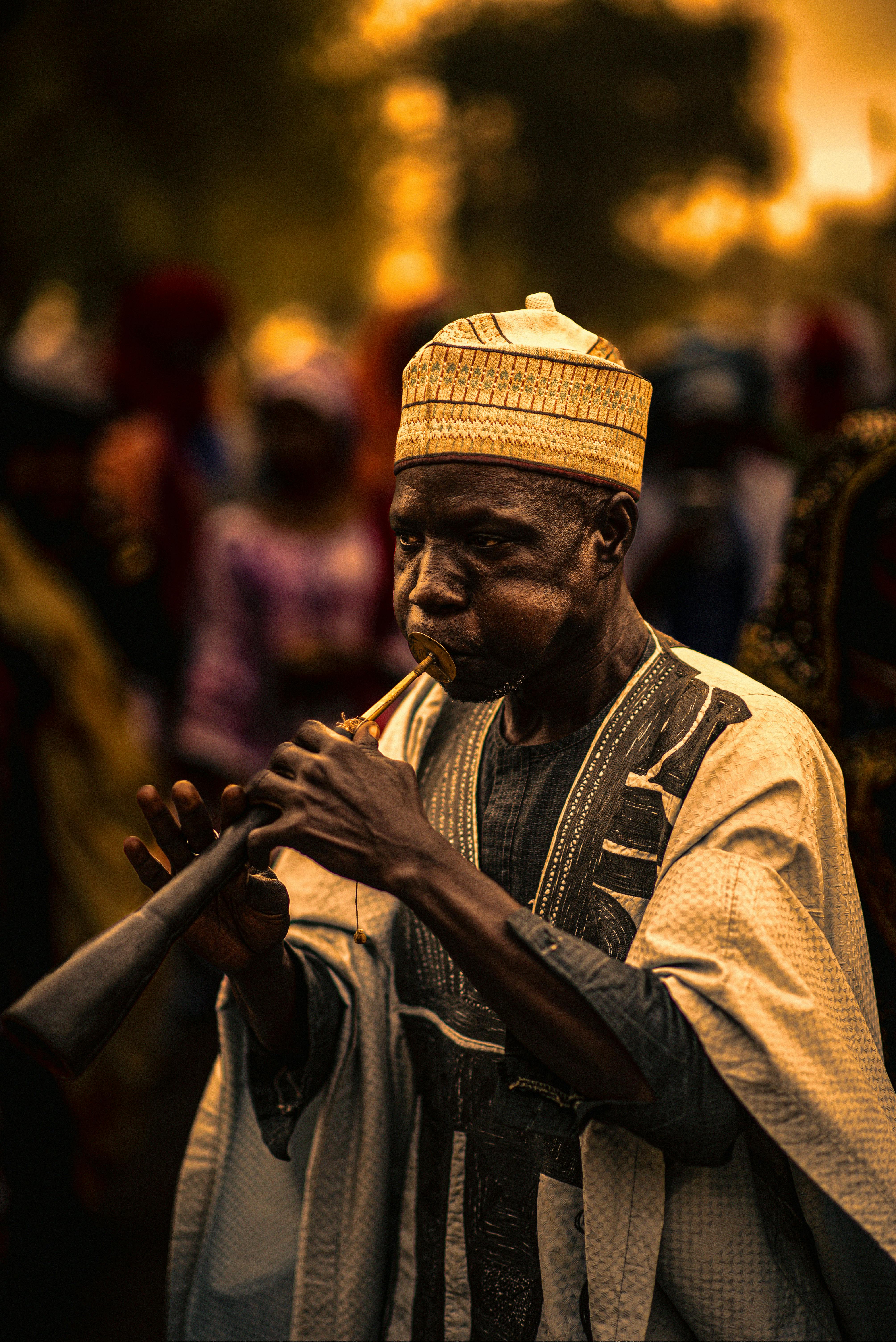 Traditional Musician Playing Wind Instrument at Festival · Free Stock Photo