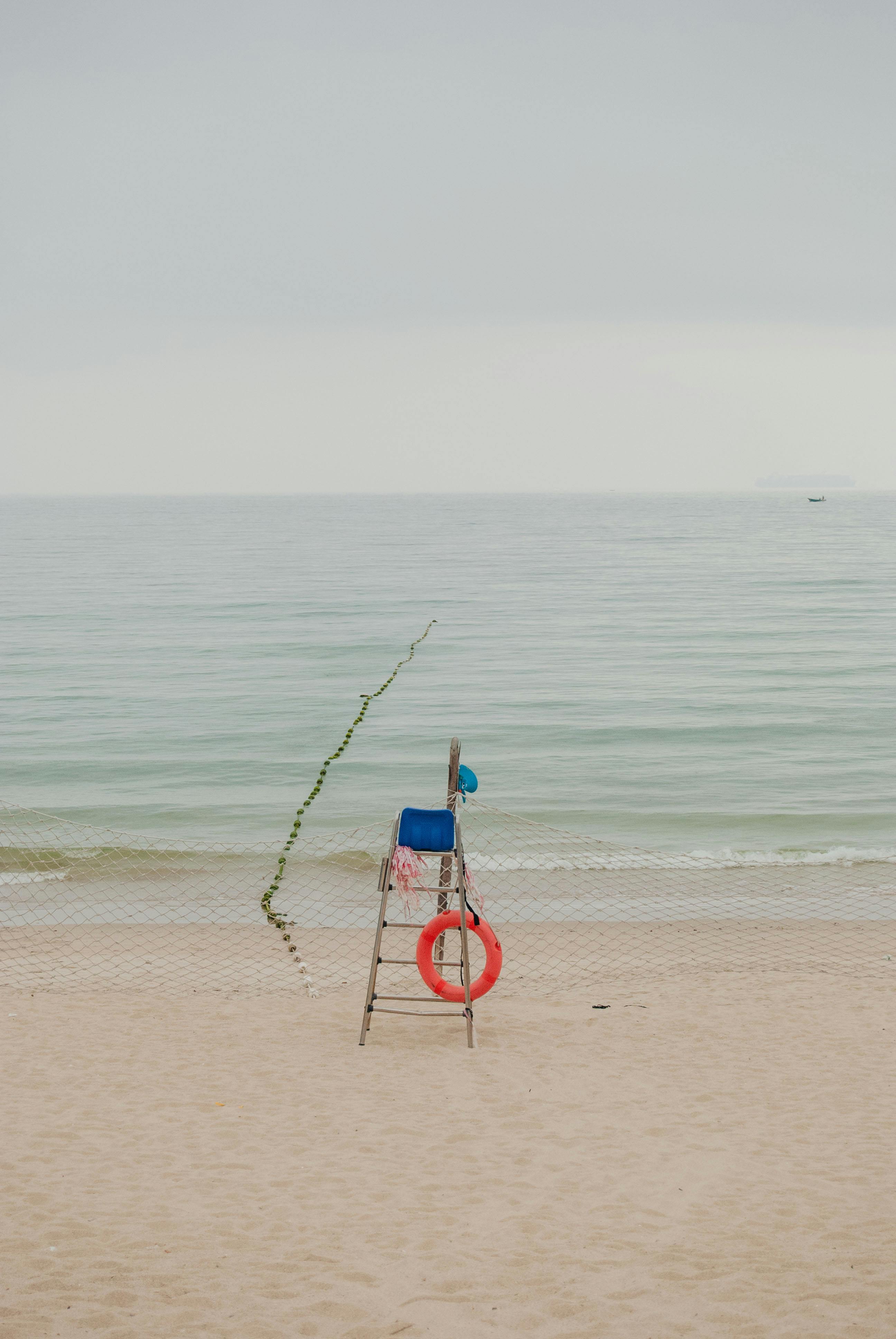 Grey Metal Step Ladder Near Beach during Daytime · Free Stock Photo