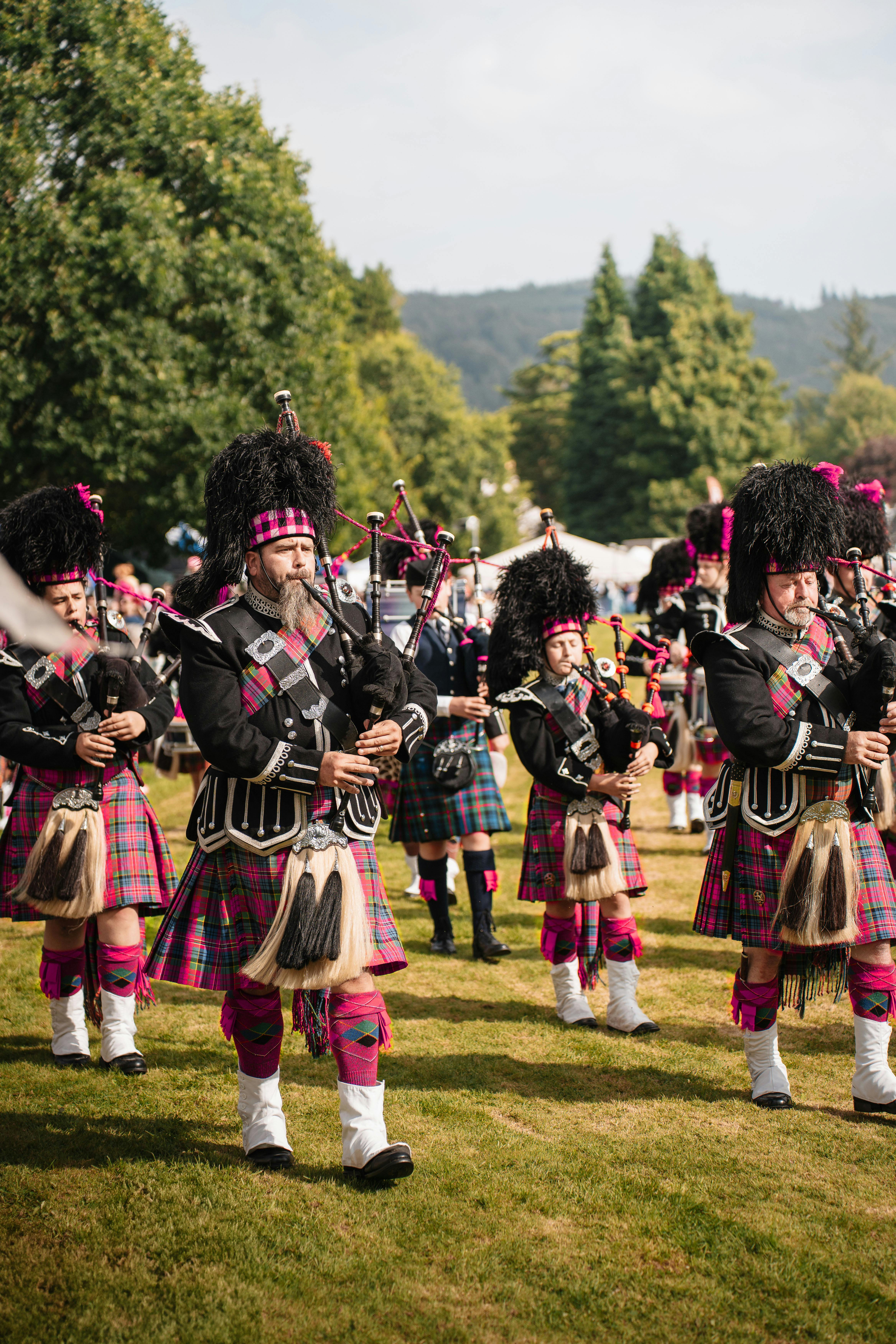 Traditional Scottish Bagpipe Band Outdoors · Free Stock Photo