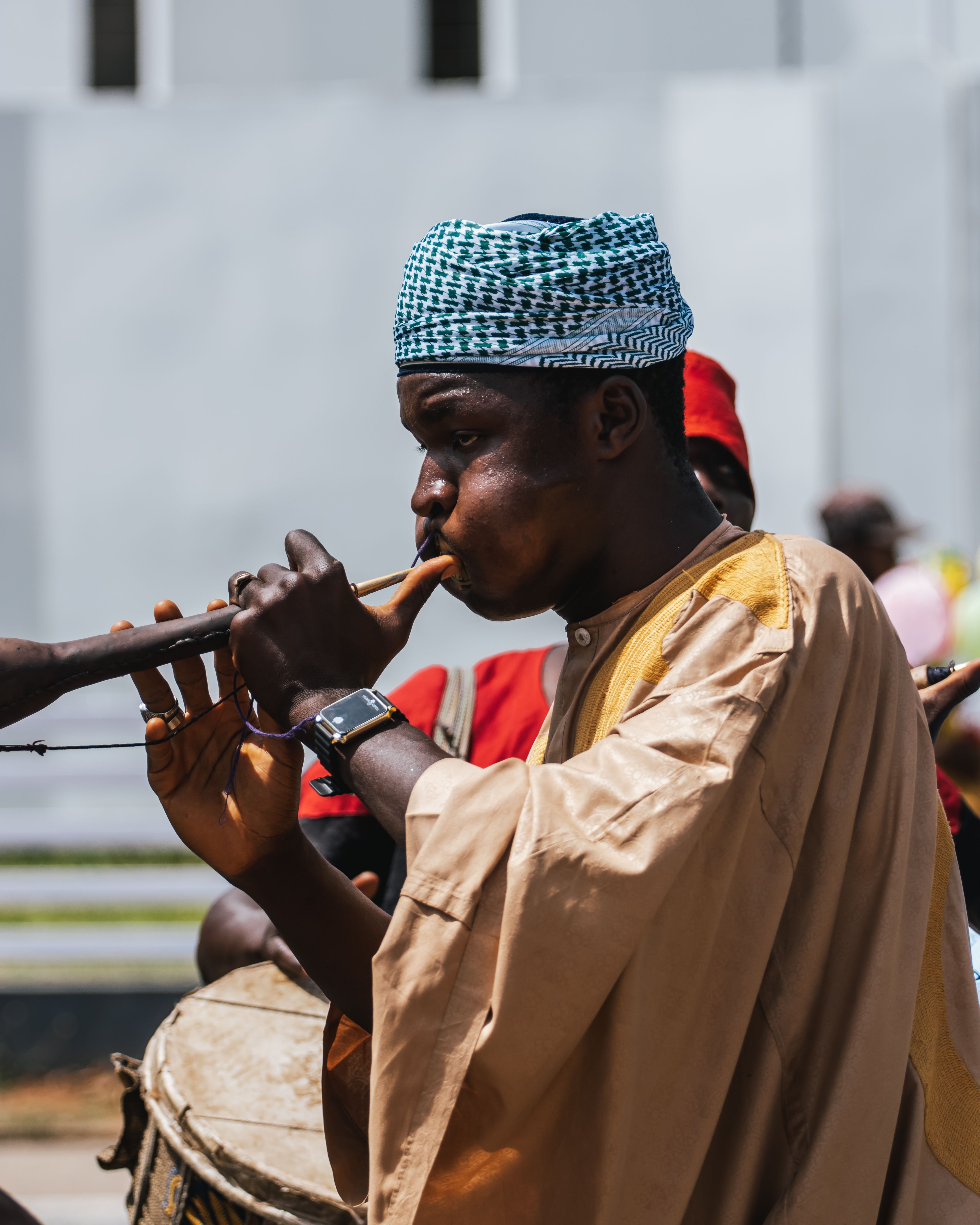 Traditional African Musician Playing Flute Outdoors · Free Stock Photo