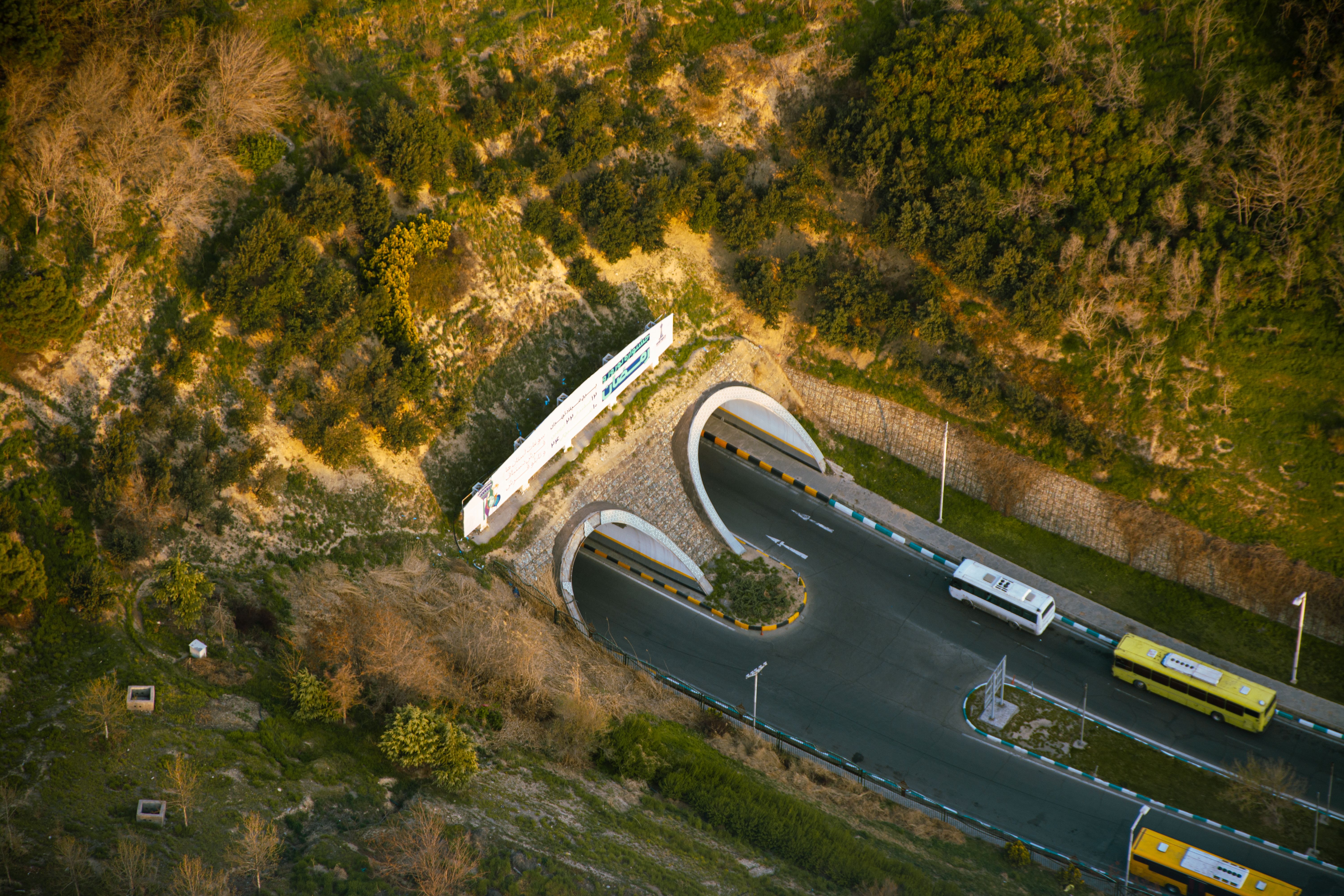 Aerial View of Road Tunnel in Lush Greenery · Free Stock Photo