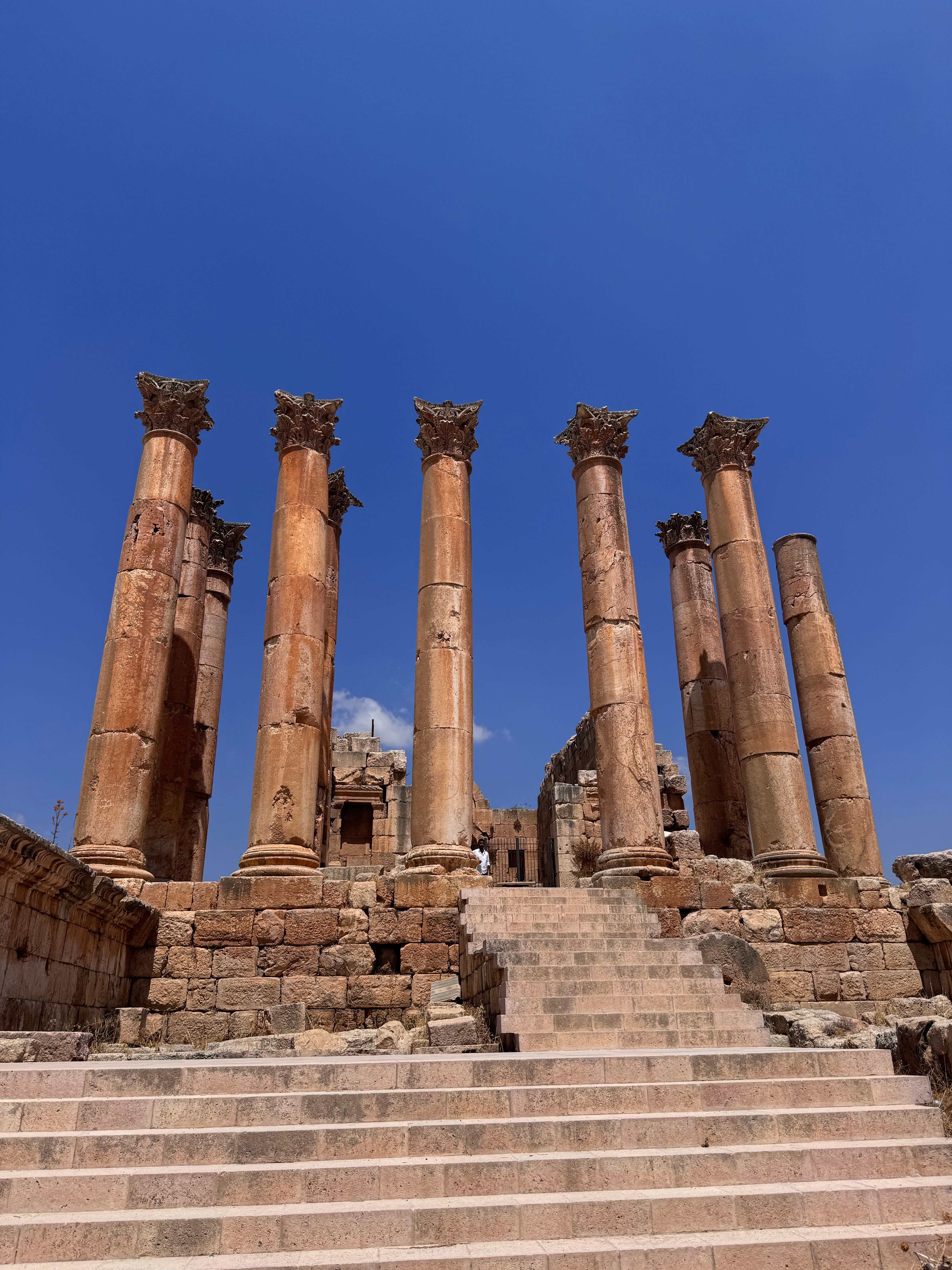 Ancient Roman Columns at Jerash Against Clear Blue Sky · Free Stock Photo