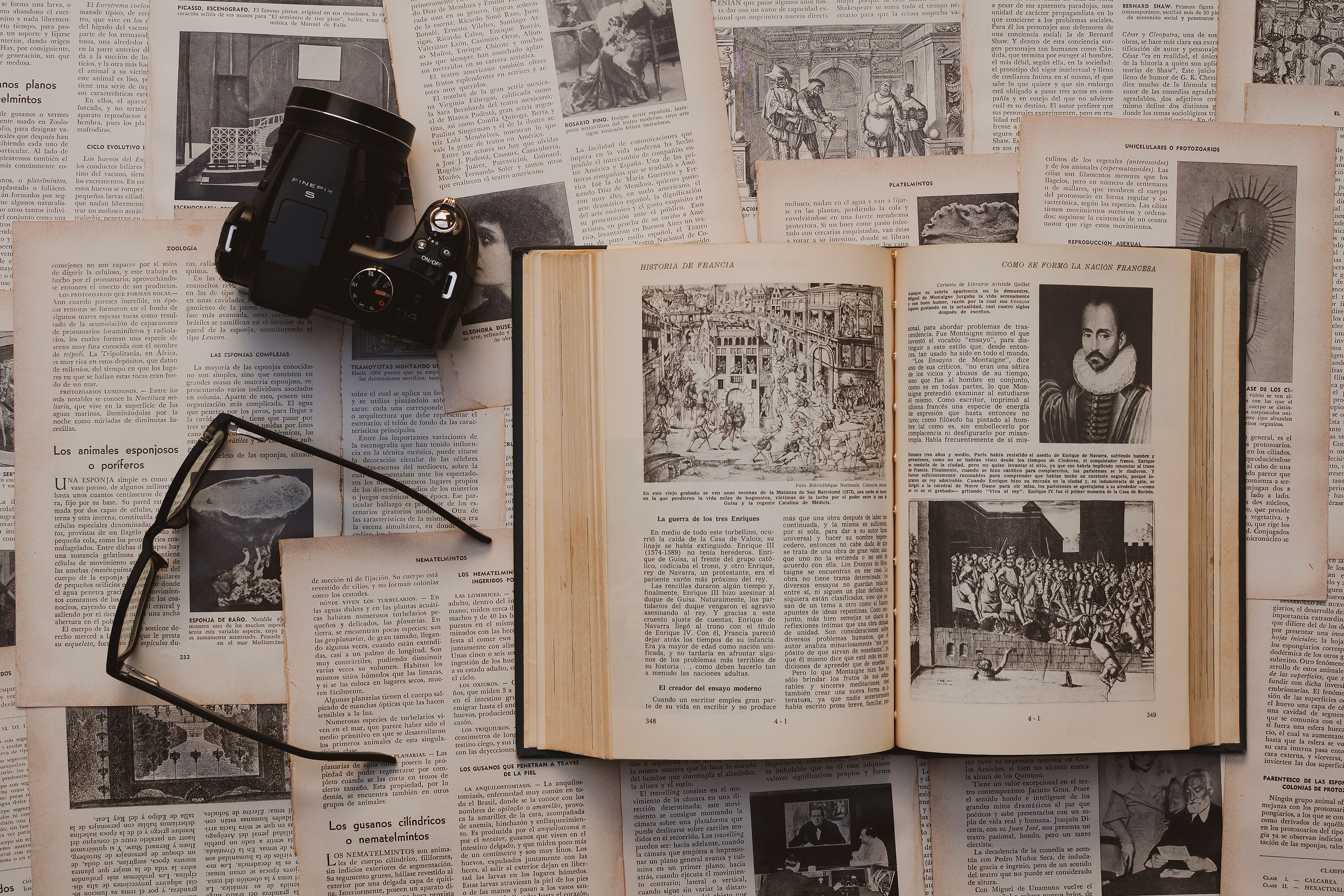 Vintage Book and Camera on Historical Pages · Free Stock Photo