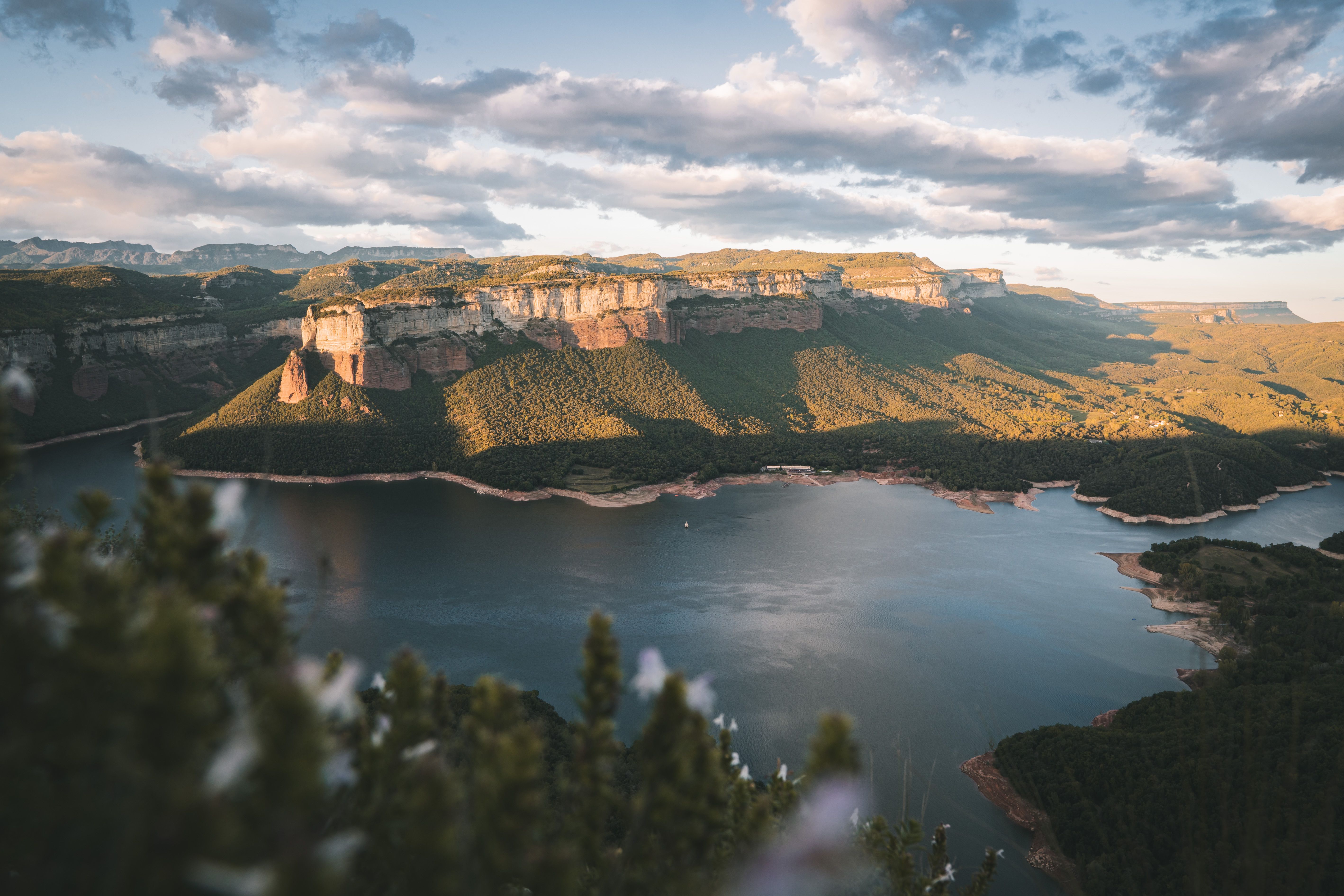 Scenic View of Tranquil Reservoir and Cliffs · Free Stock Photo