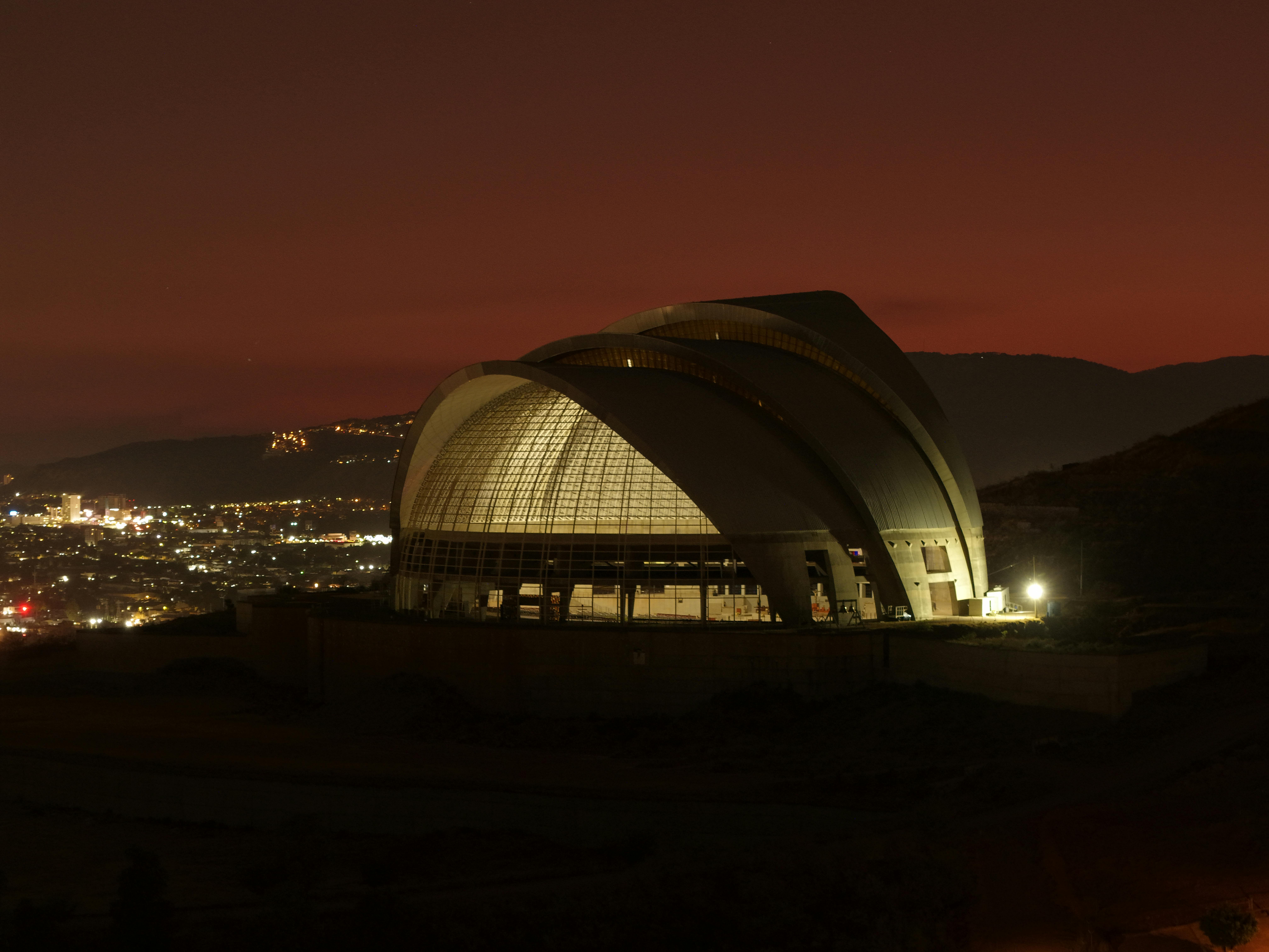 Modern Concert Hall at Night with Cityscape · Free Stock Photo