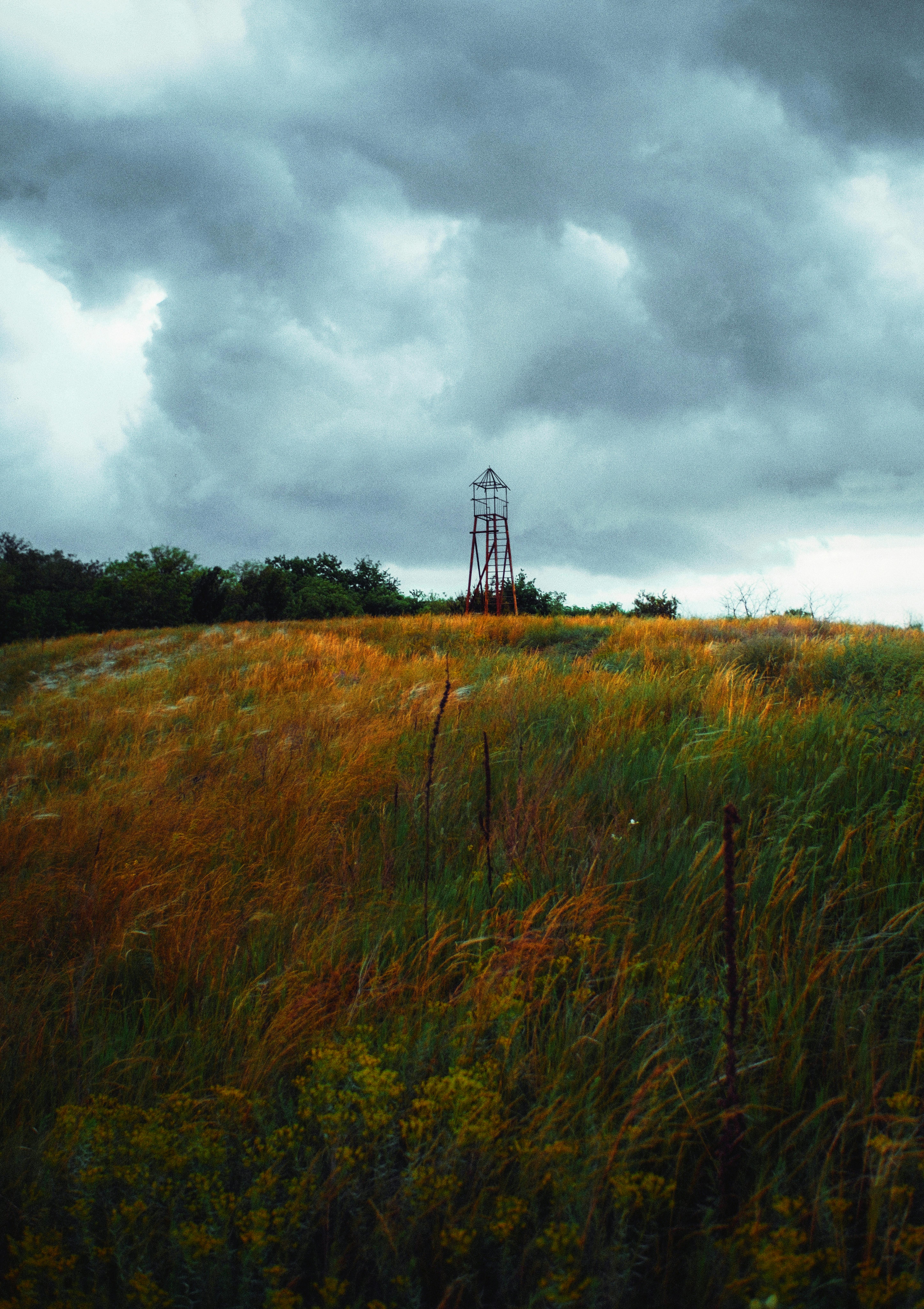 Rustic Landscape with Tower under Dramatic Clouds · Free Stock Photo