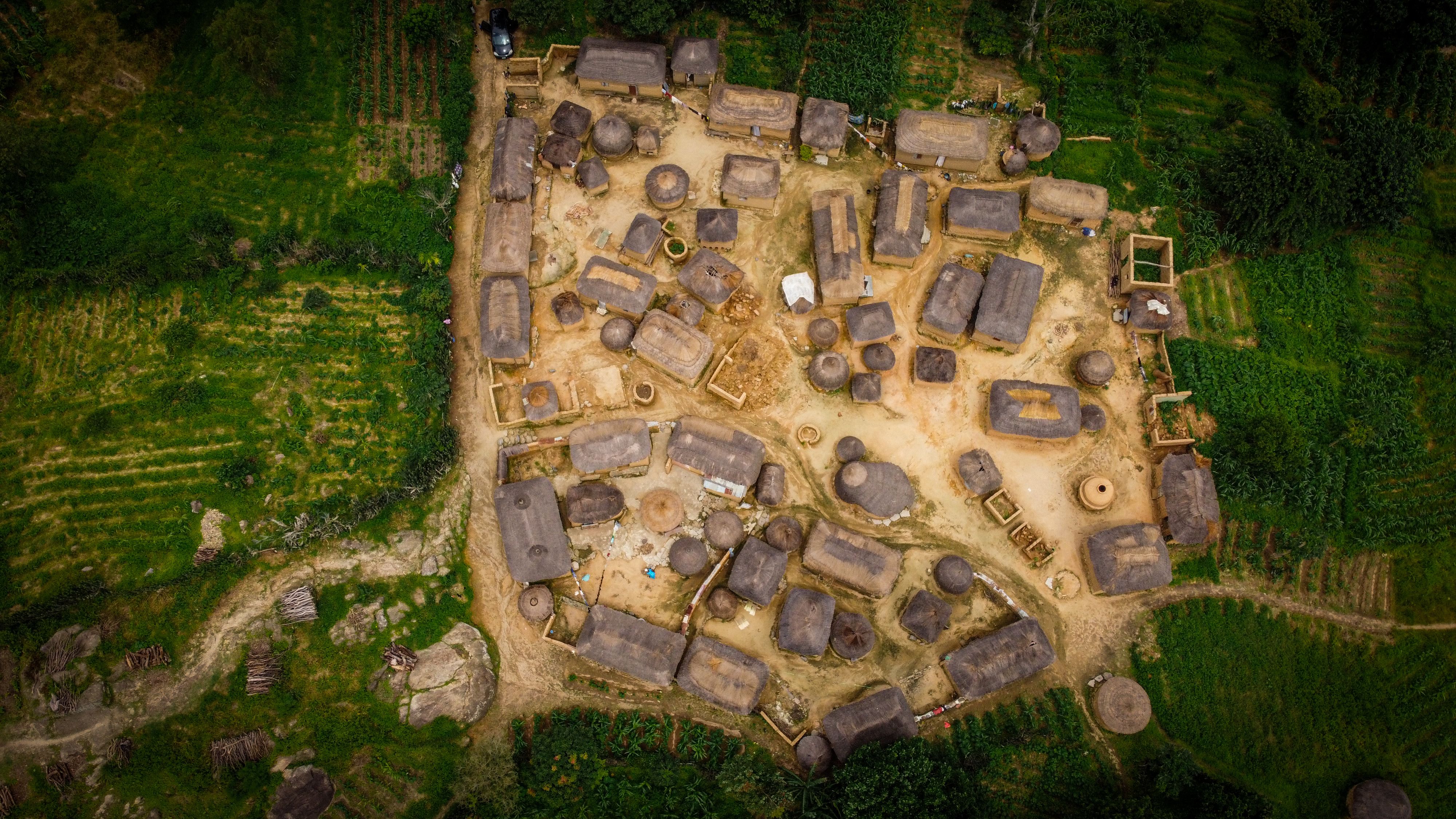 Aerial View of Traditional Village in Lush Landscape · Free Stock Photo