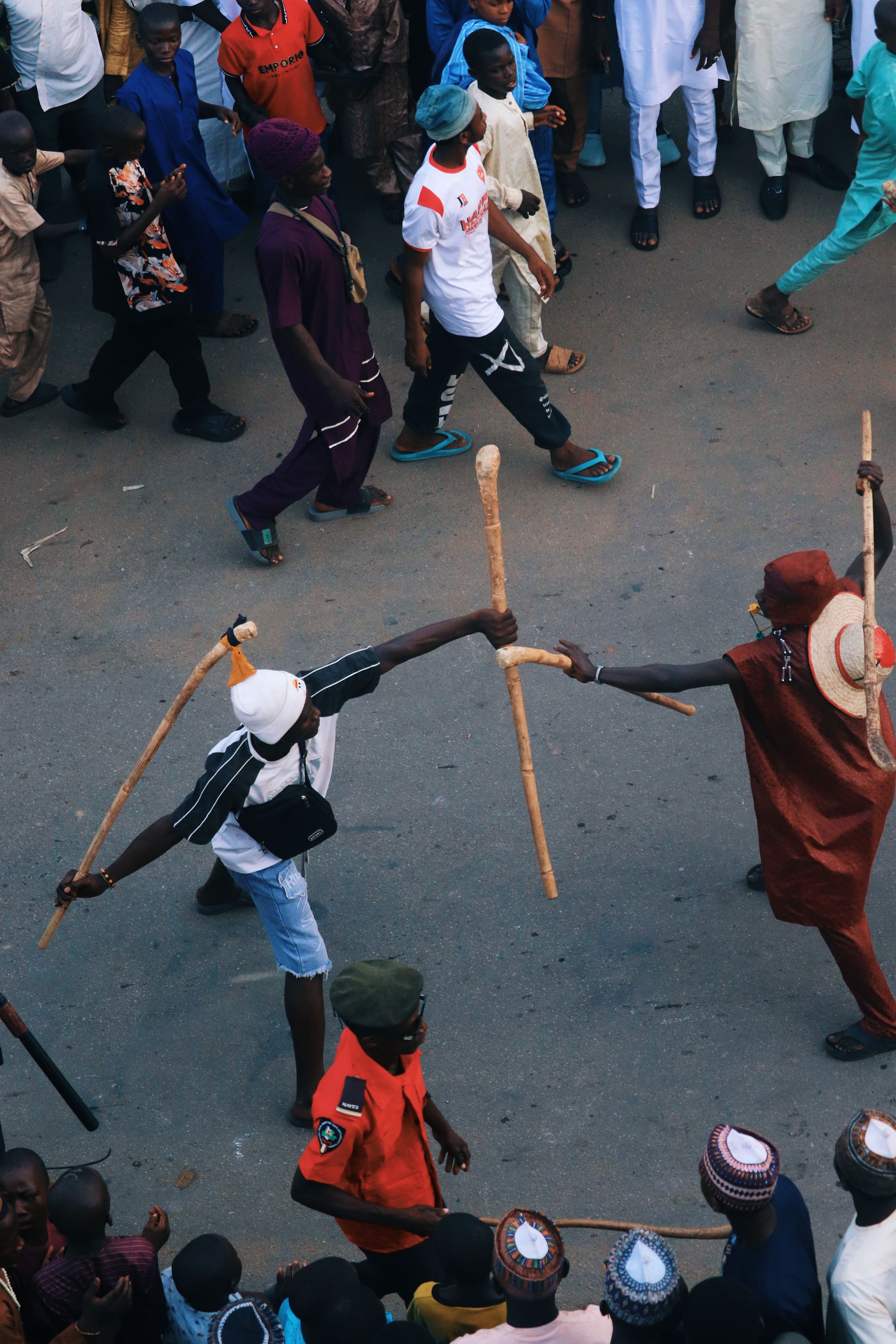 Traditional Stick Fight Performance in Street Parade · Free Stock Photo