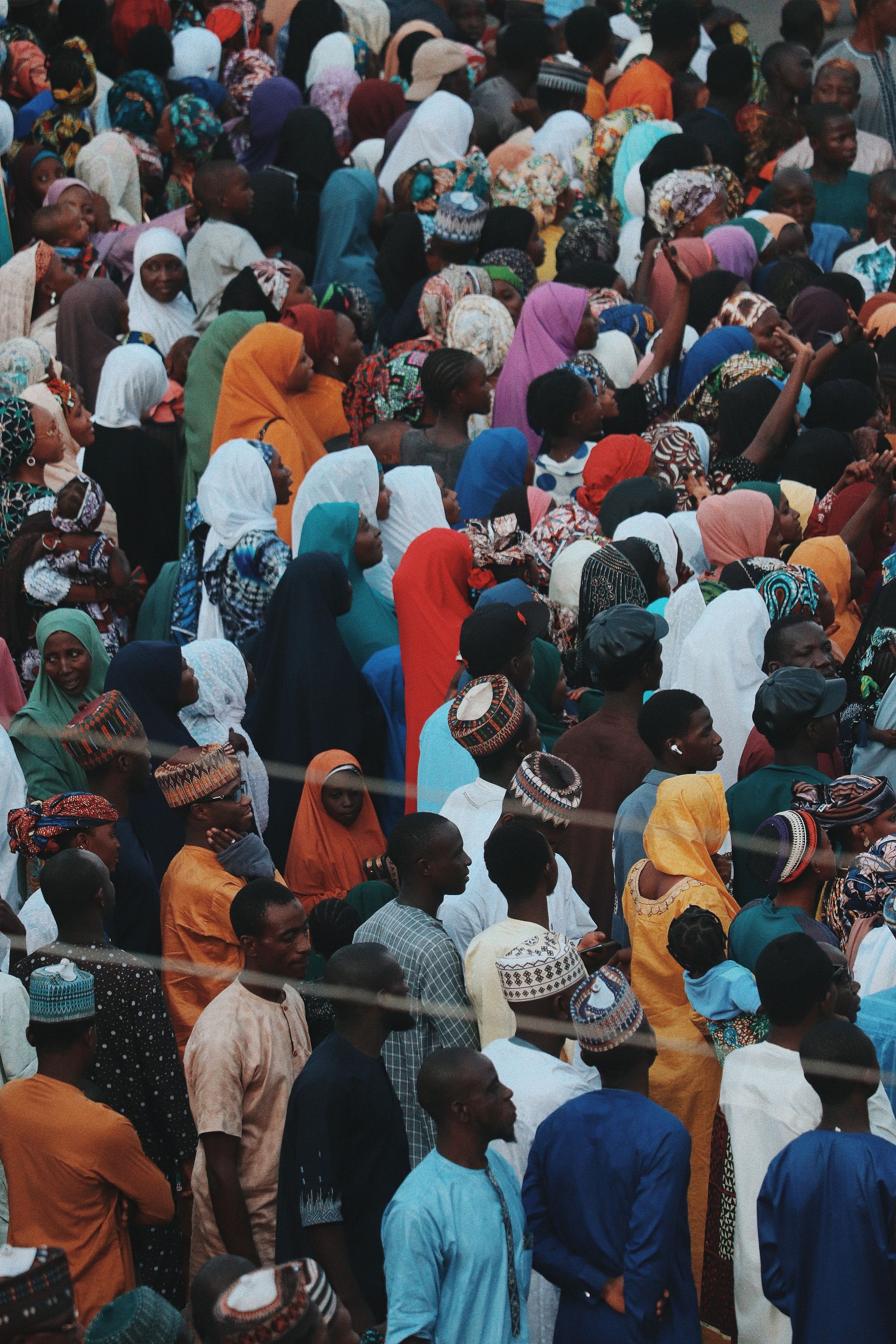 Colorful Crowd in Traditional Clothing Gathering · Free Stock Photo