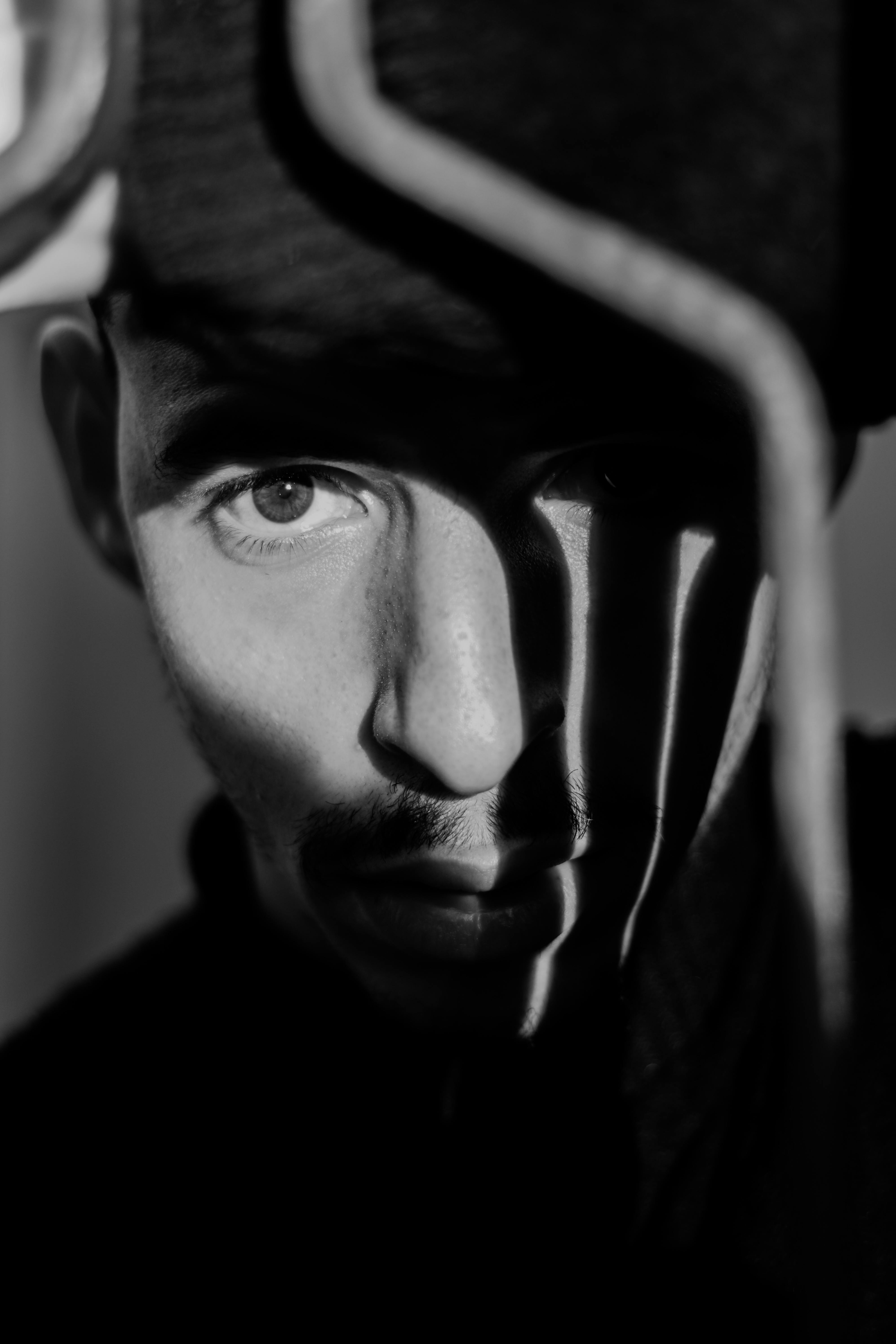 Dramatic Black and White Portrait with Shadows · Free Stock Photo