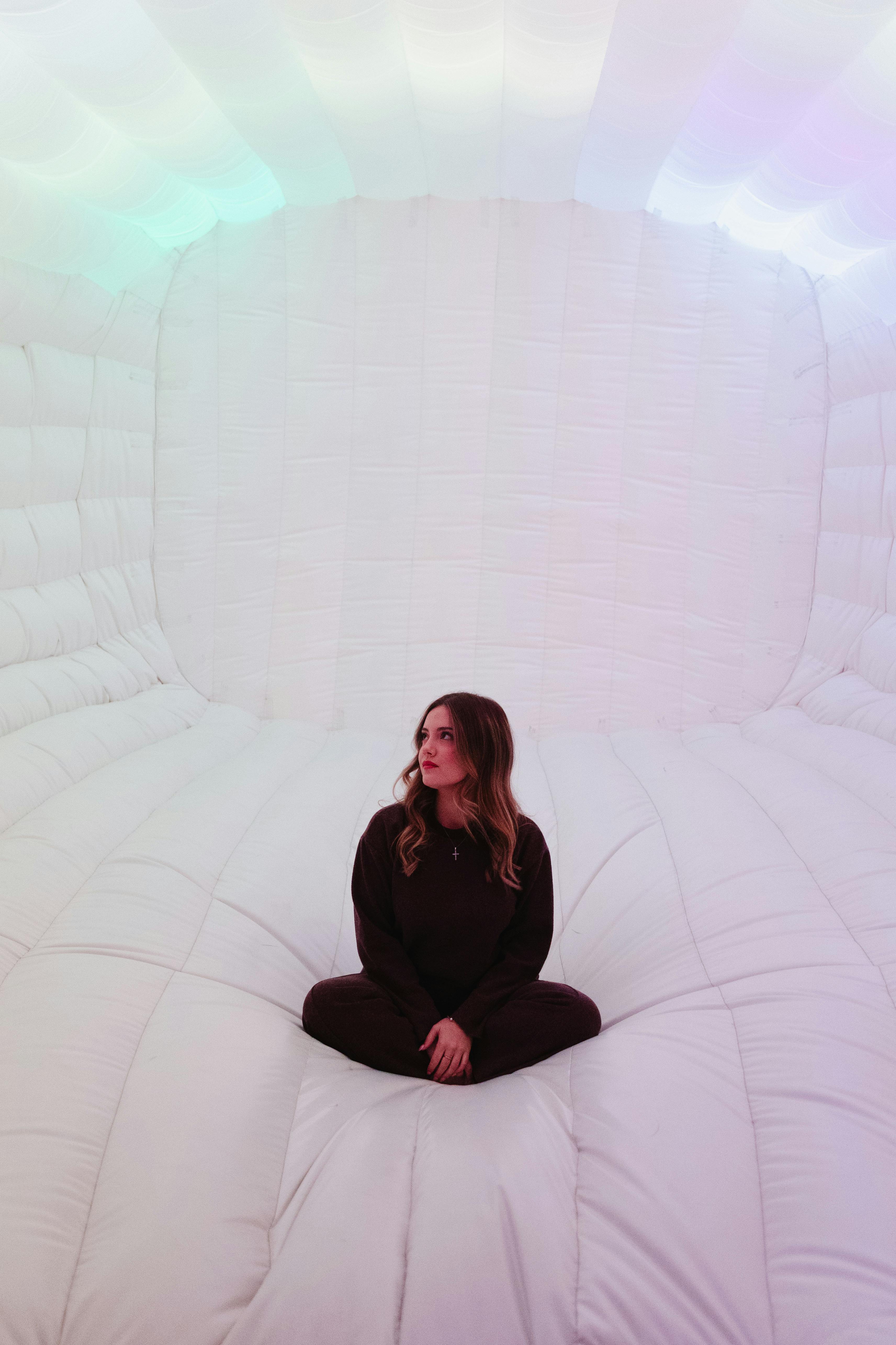 Woman in Relaxing Inflatable Room Interior · Free Stock Photo