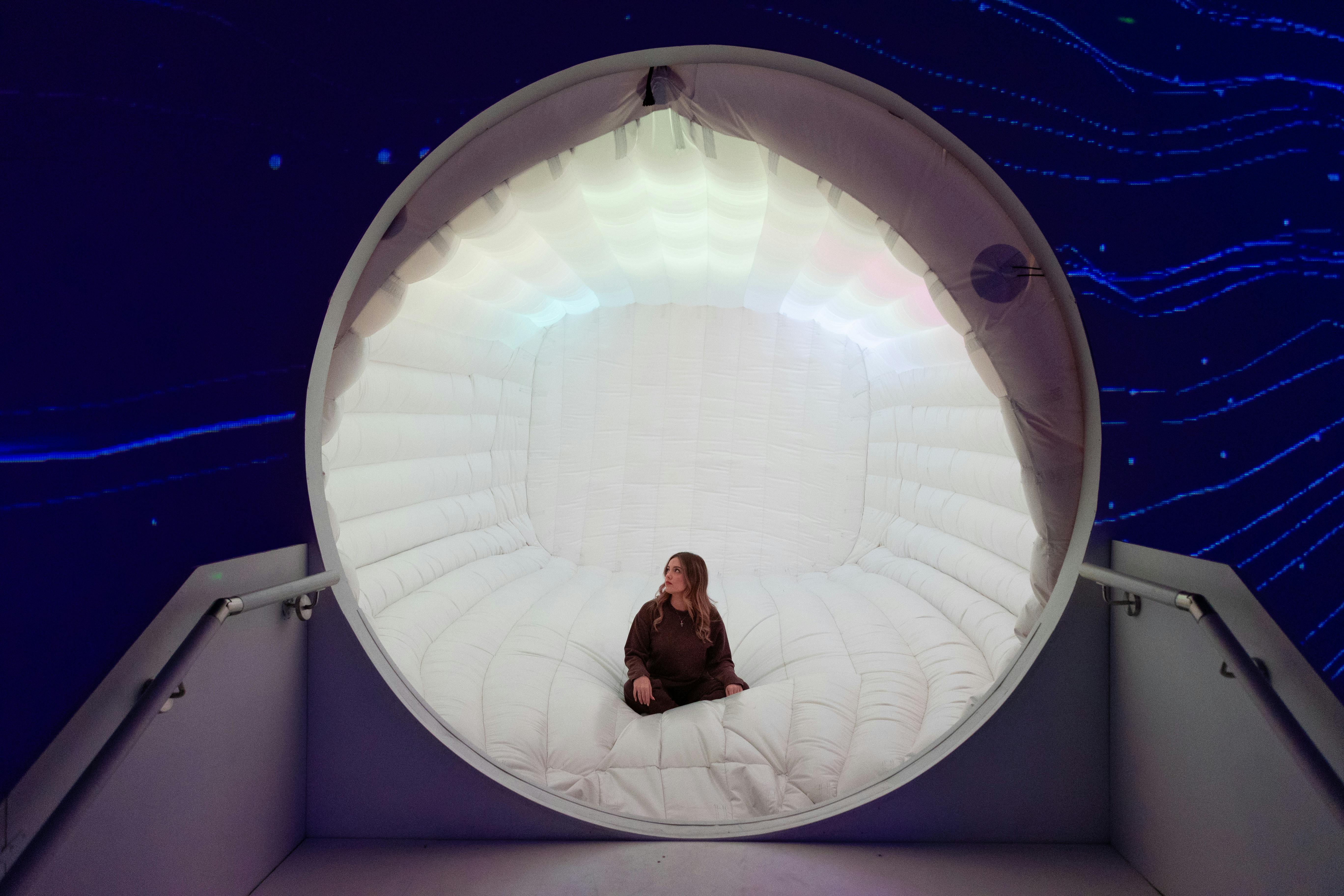 Futuristic Capsule Experience with Woman Seated · Free Stock Photo