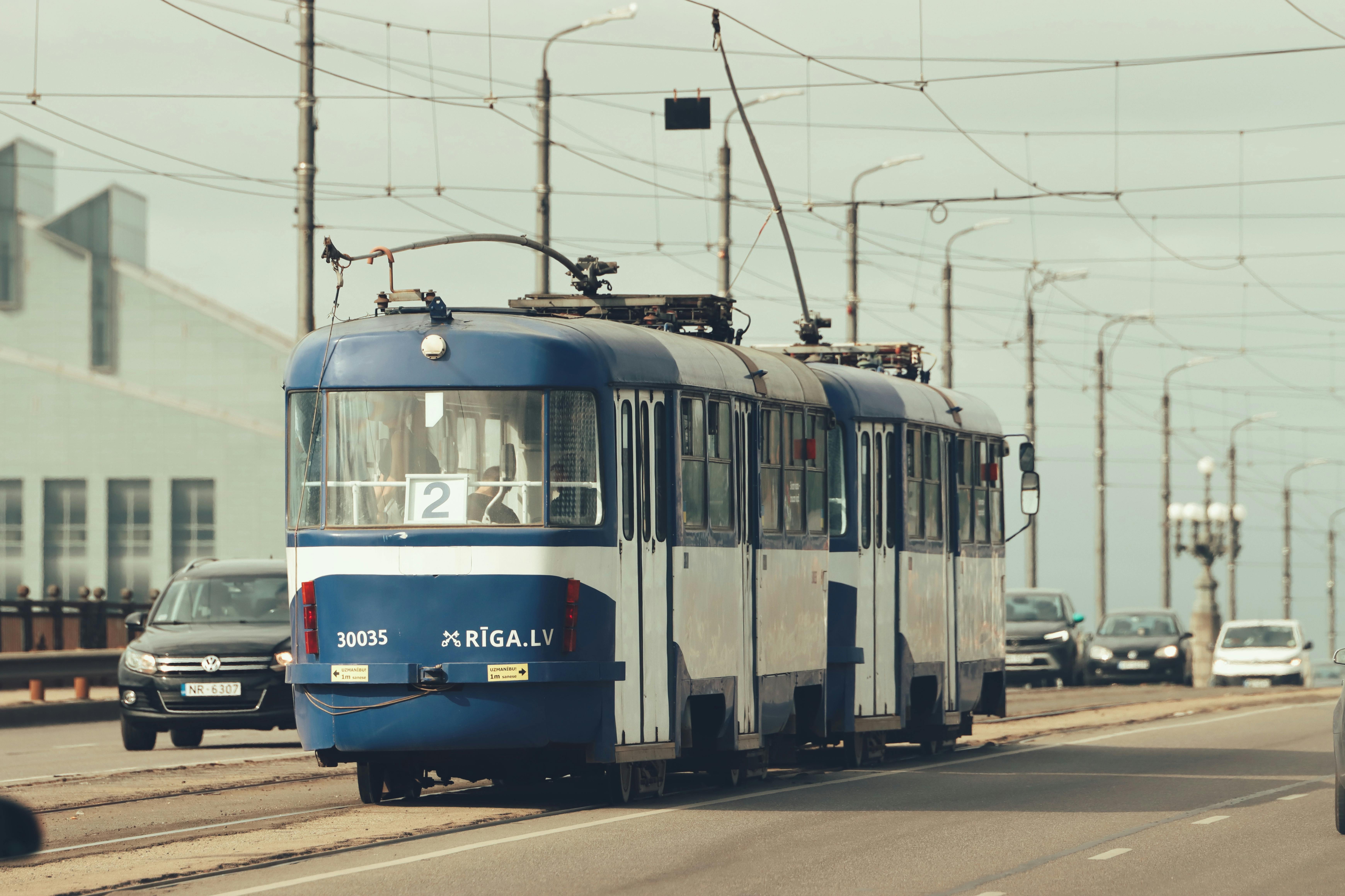 Riga Tram on City Street with Cars in View · Free Stock Photo