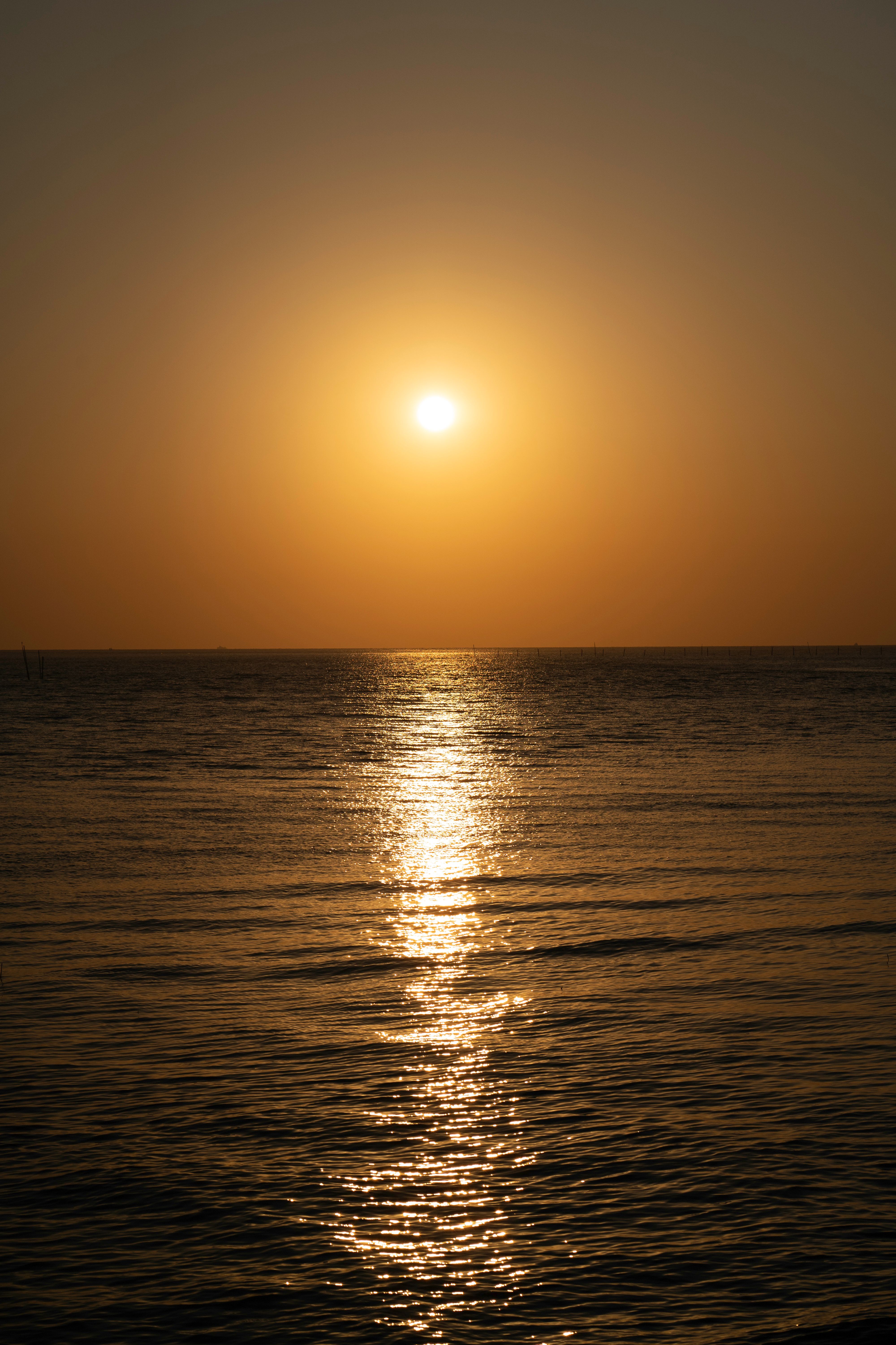Body of Water Under Sunset · Free Stock Photo