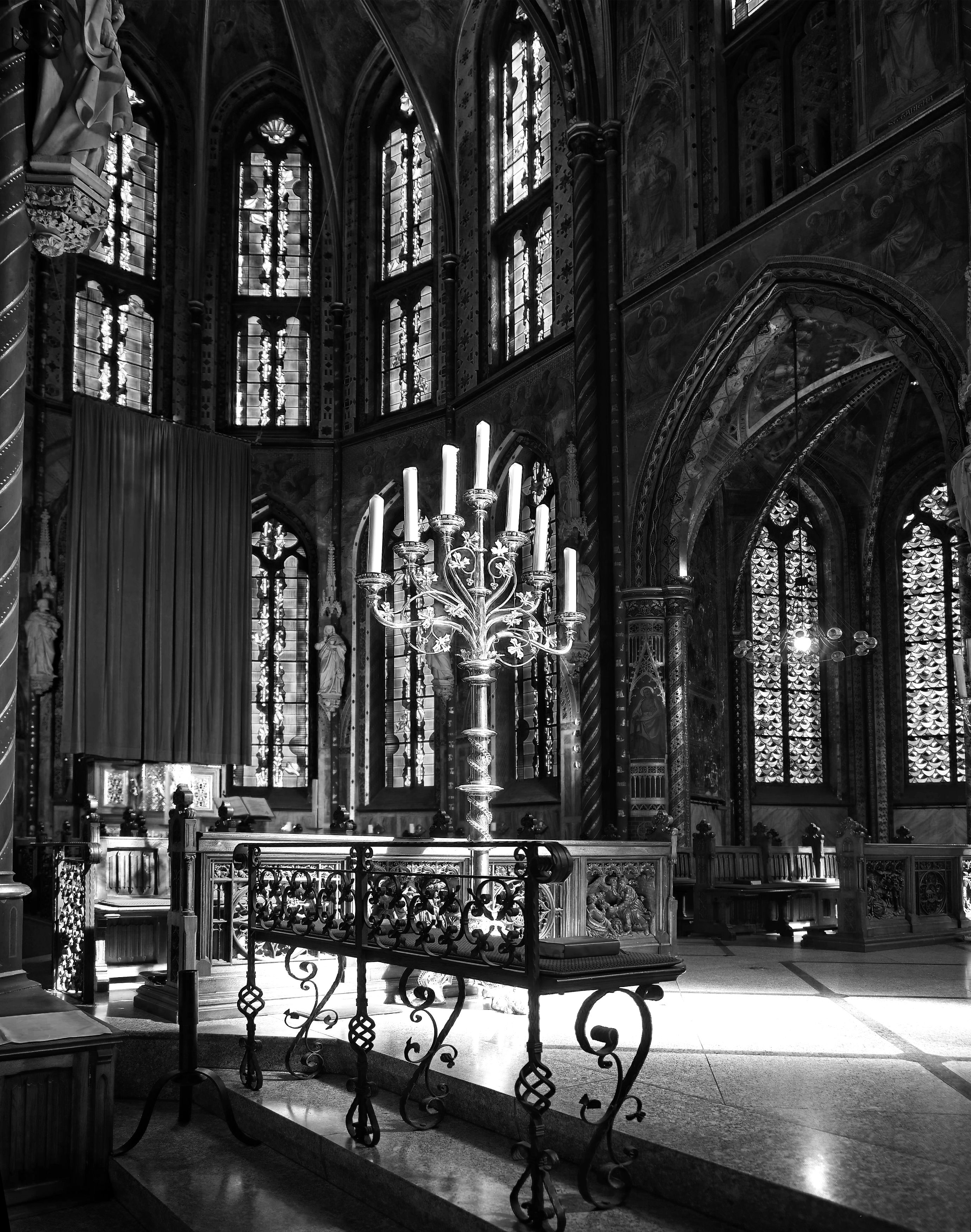 Gothic Church Interior with Candlelit Atmosphere · Free Stock Photo