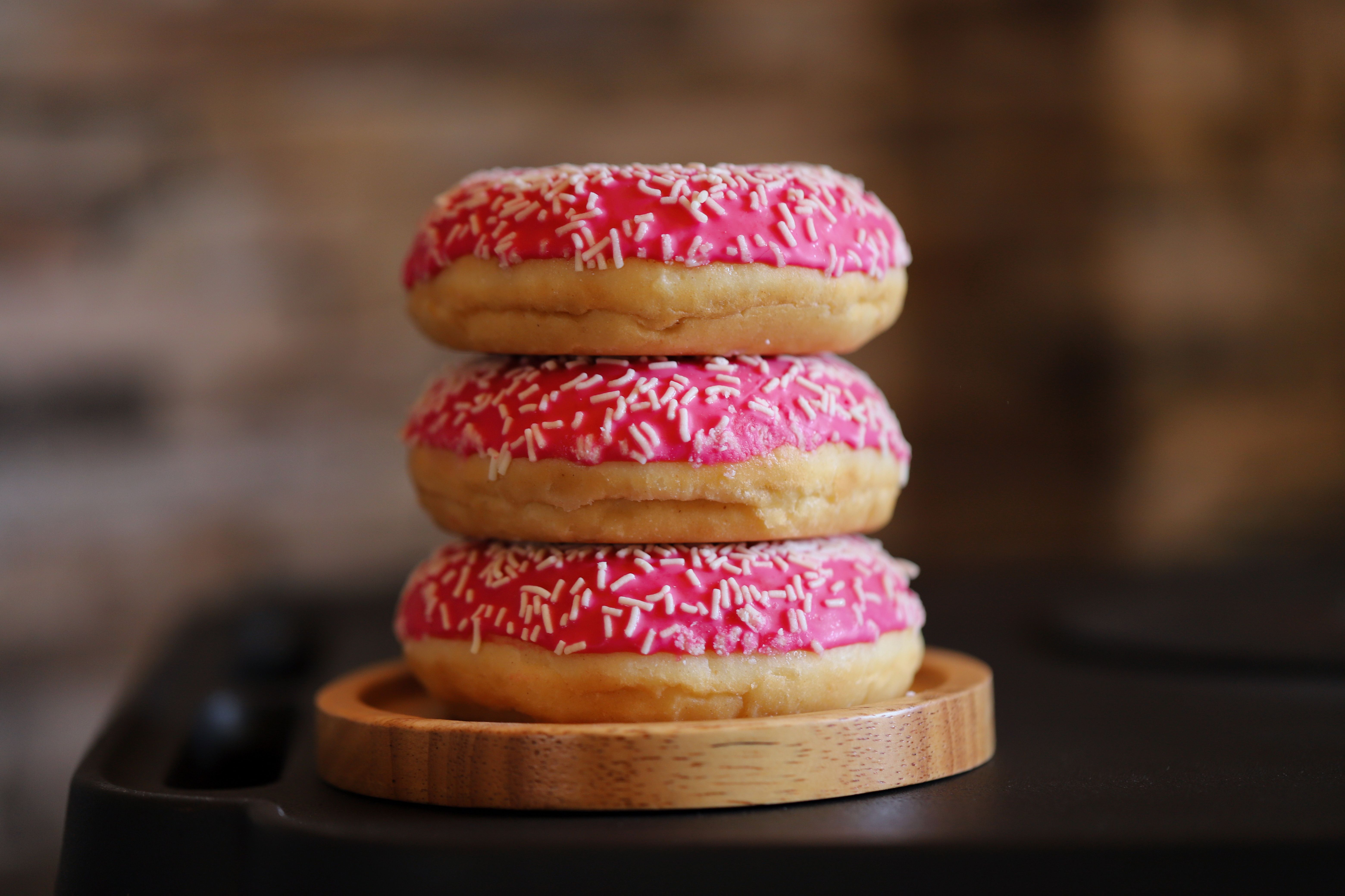 Stack of Pink Frosted Donuts with Sprinkles · Free Stock Photo