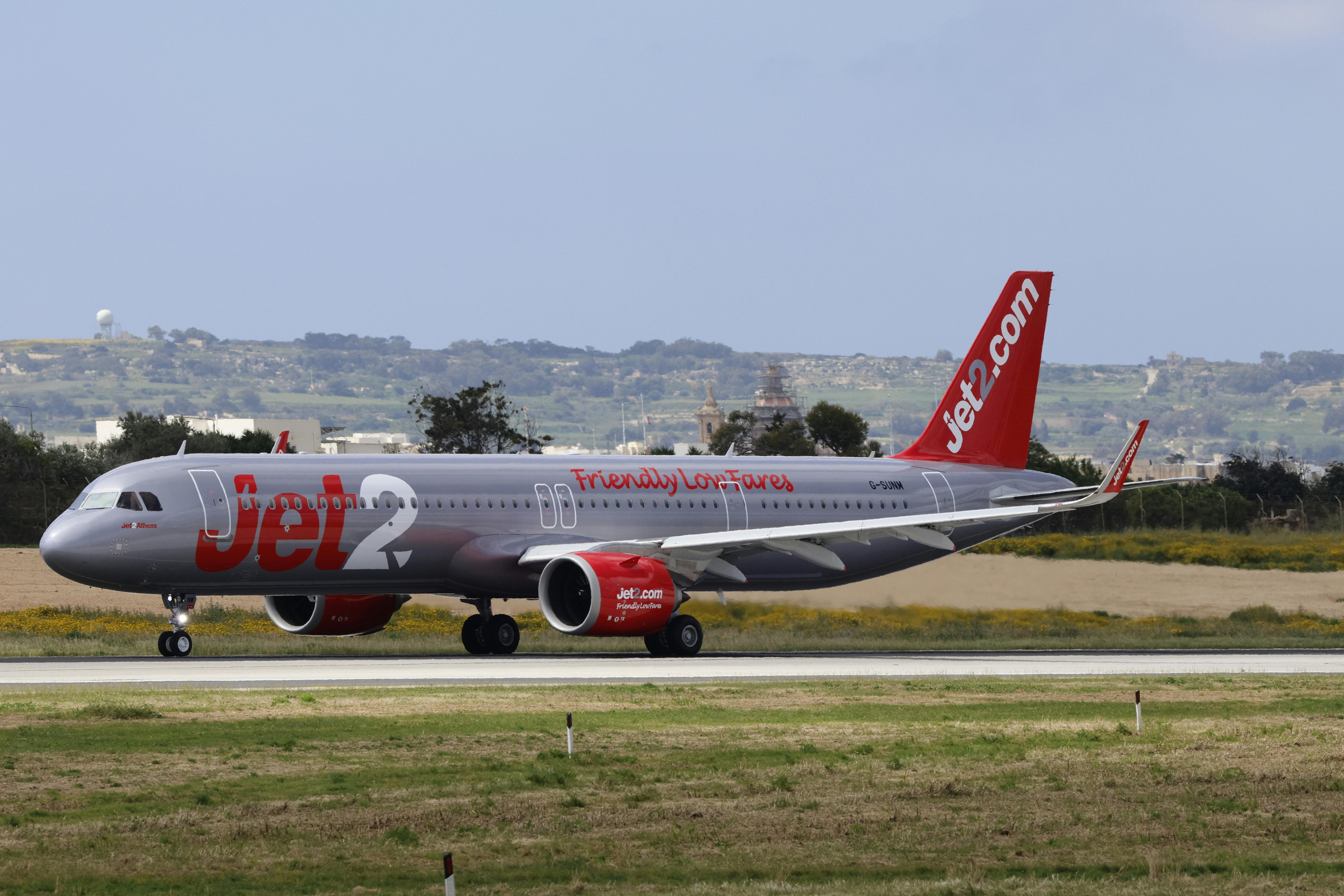 Jet2 Airplane on Runway with Scenic Background · Free Stock Photo