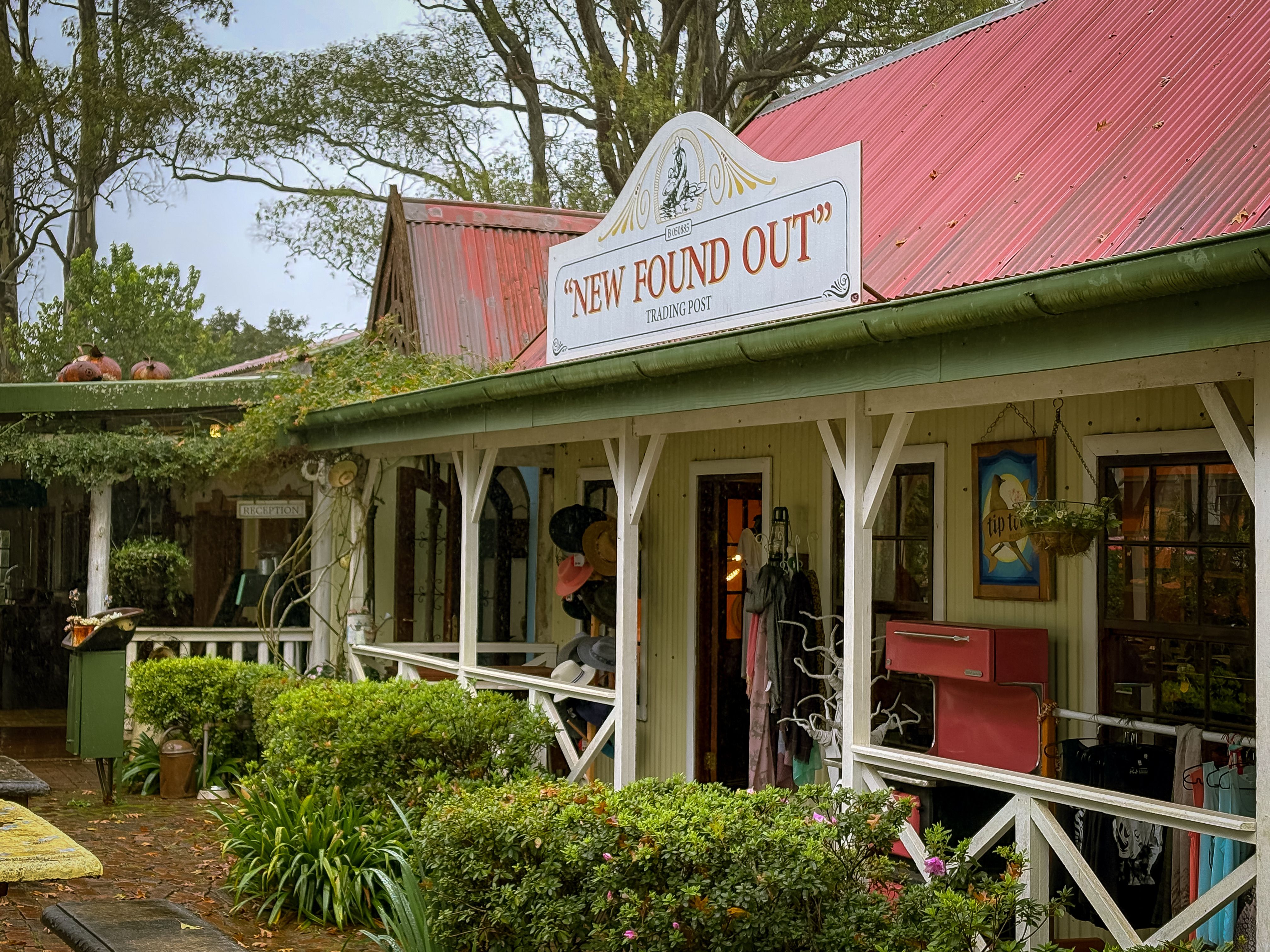 Charming Vintage Trading Post Exterior with Red Roof · Free Stock Photo
