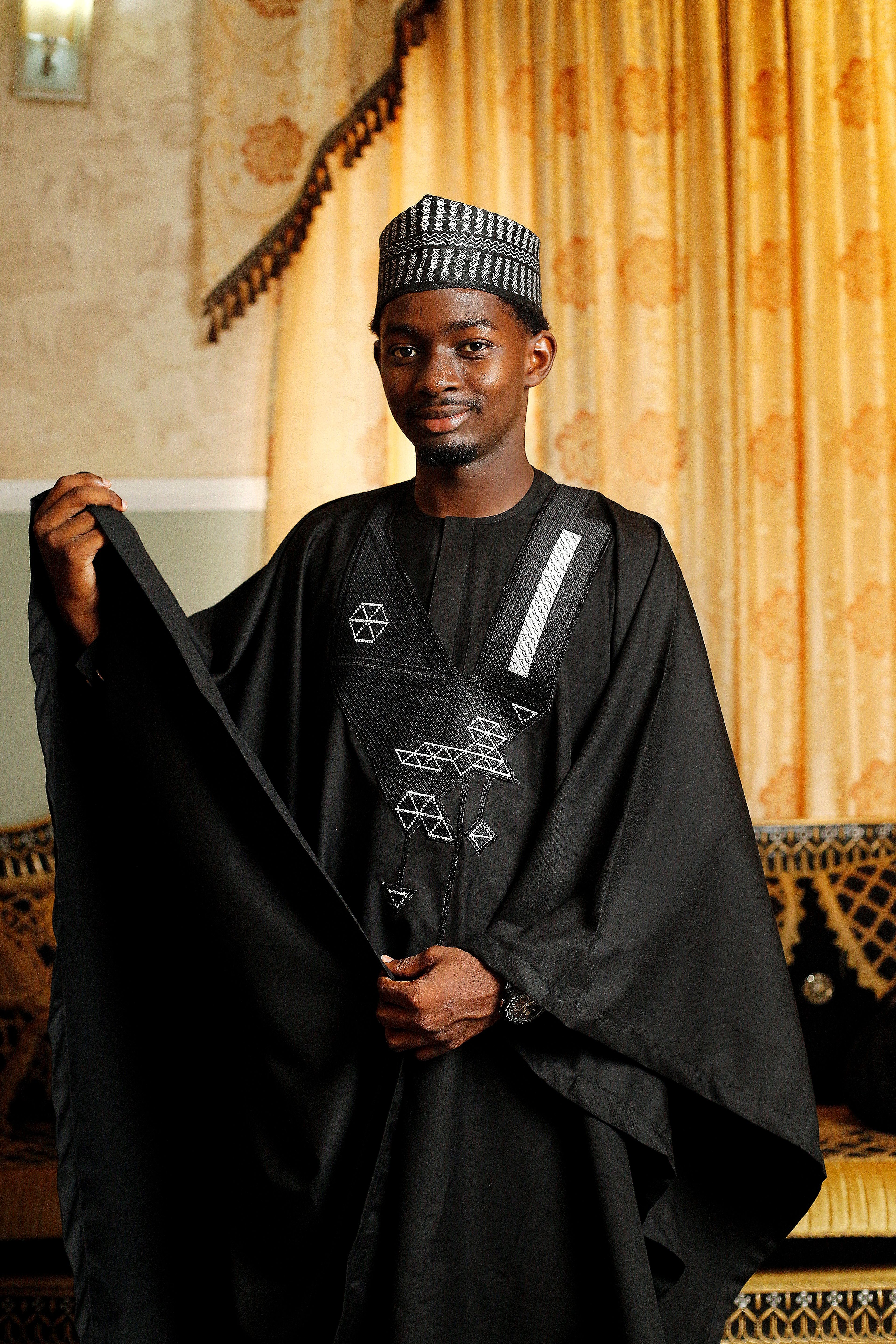 Traditional Nigerian Attire in Elegant Indoor Setting · Free Stock Photo