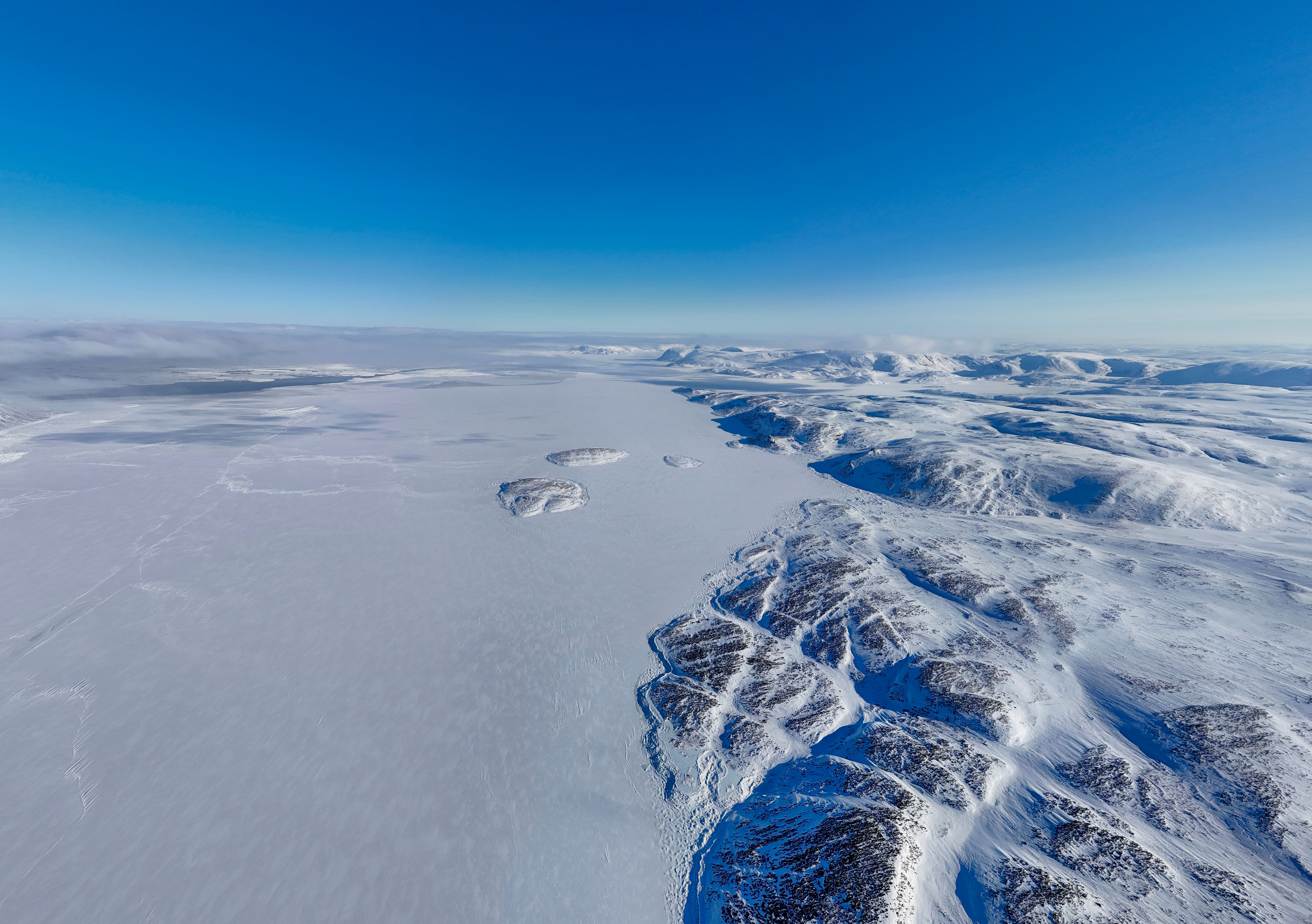 Aerial View of Snow-Covered Arctic Landscape · Free Stock Photo