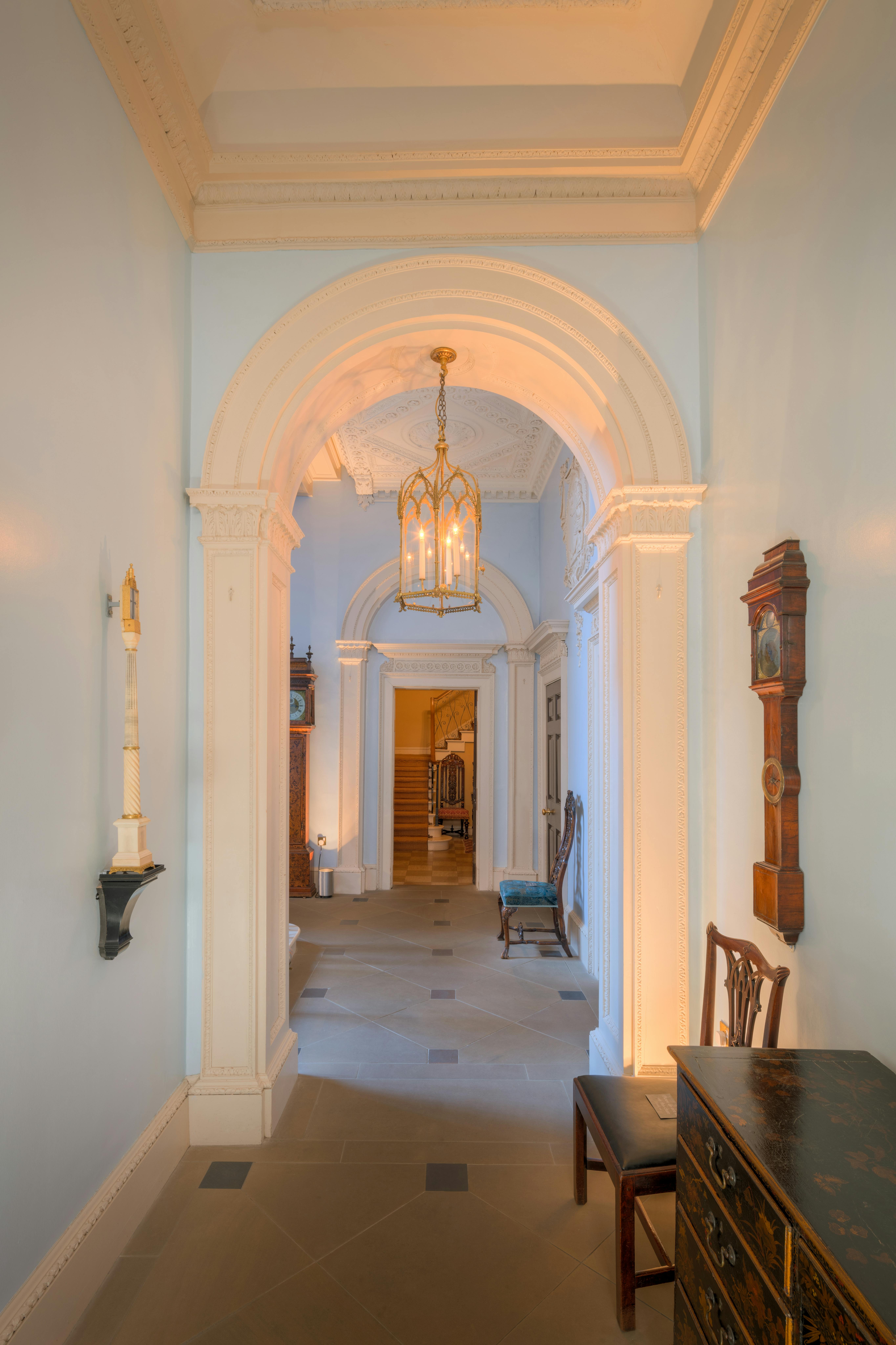 Elegant Historical Corridor with Classic Arches · Free Stock Photo