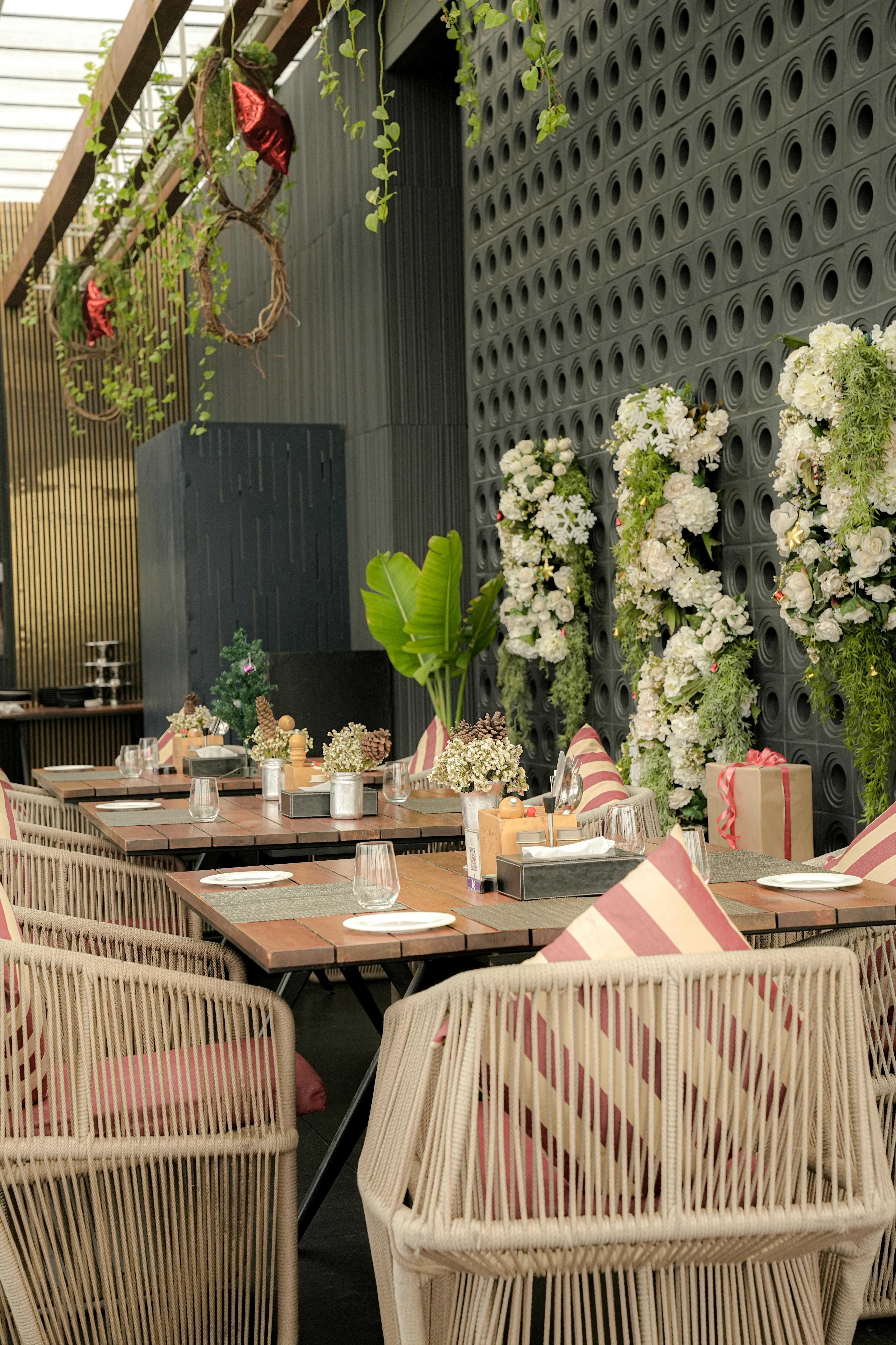 Elegant Outdoor Dining Area with Floral Decor · Free Stock Photo