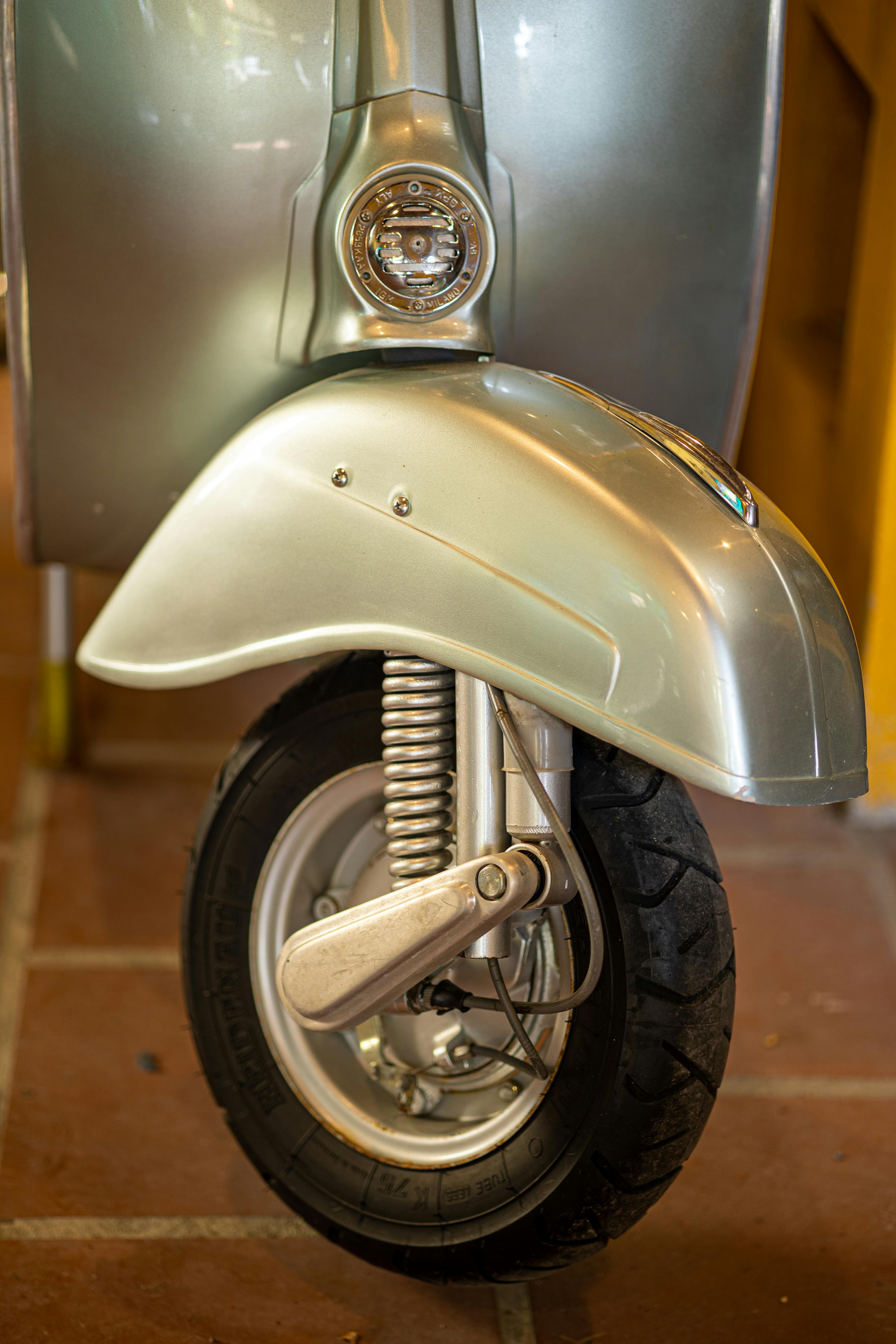 Close-up of a Classic Scooter Front Wheel · Free Stock Photo