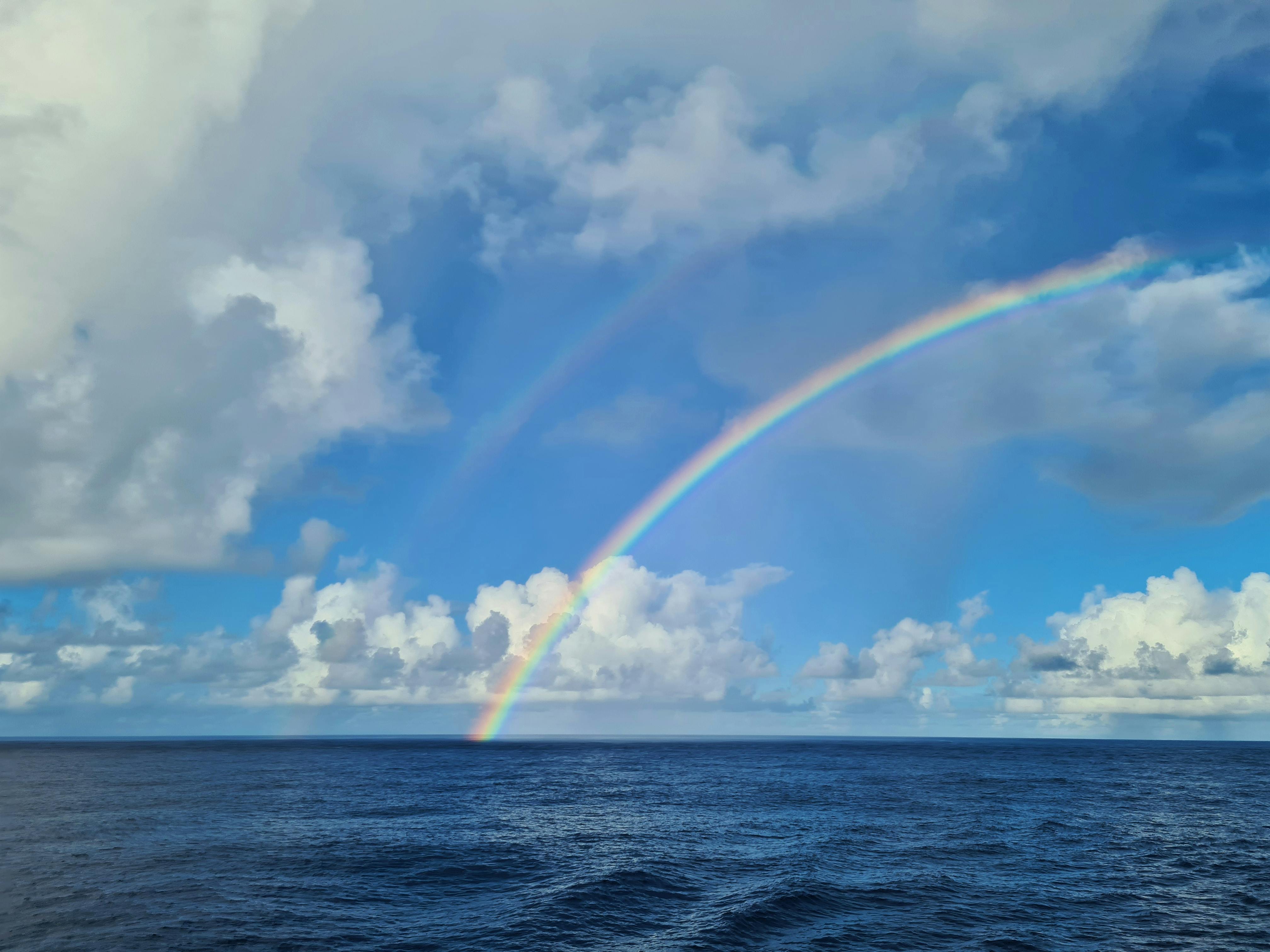 Bright Double Rainbow Over Ocean View · Free Stock Photo