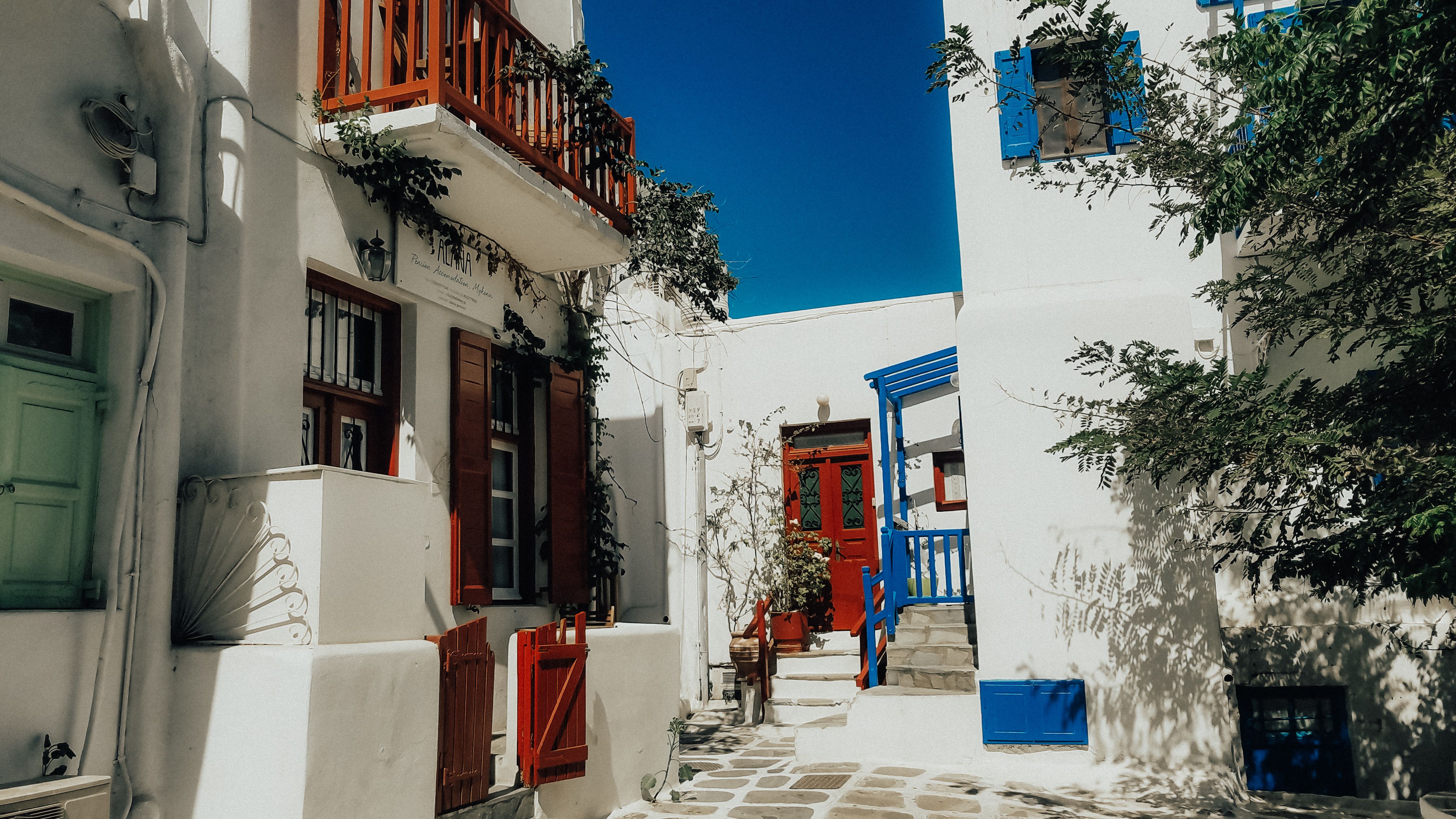 Charming Mykonos Street with Colorful Doors · Free Stock Photo