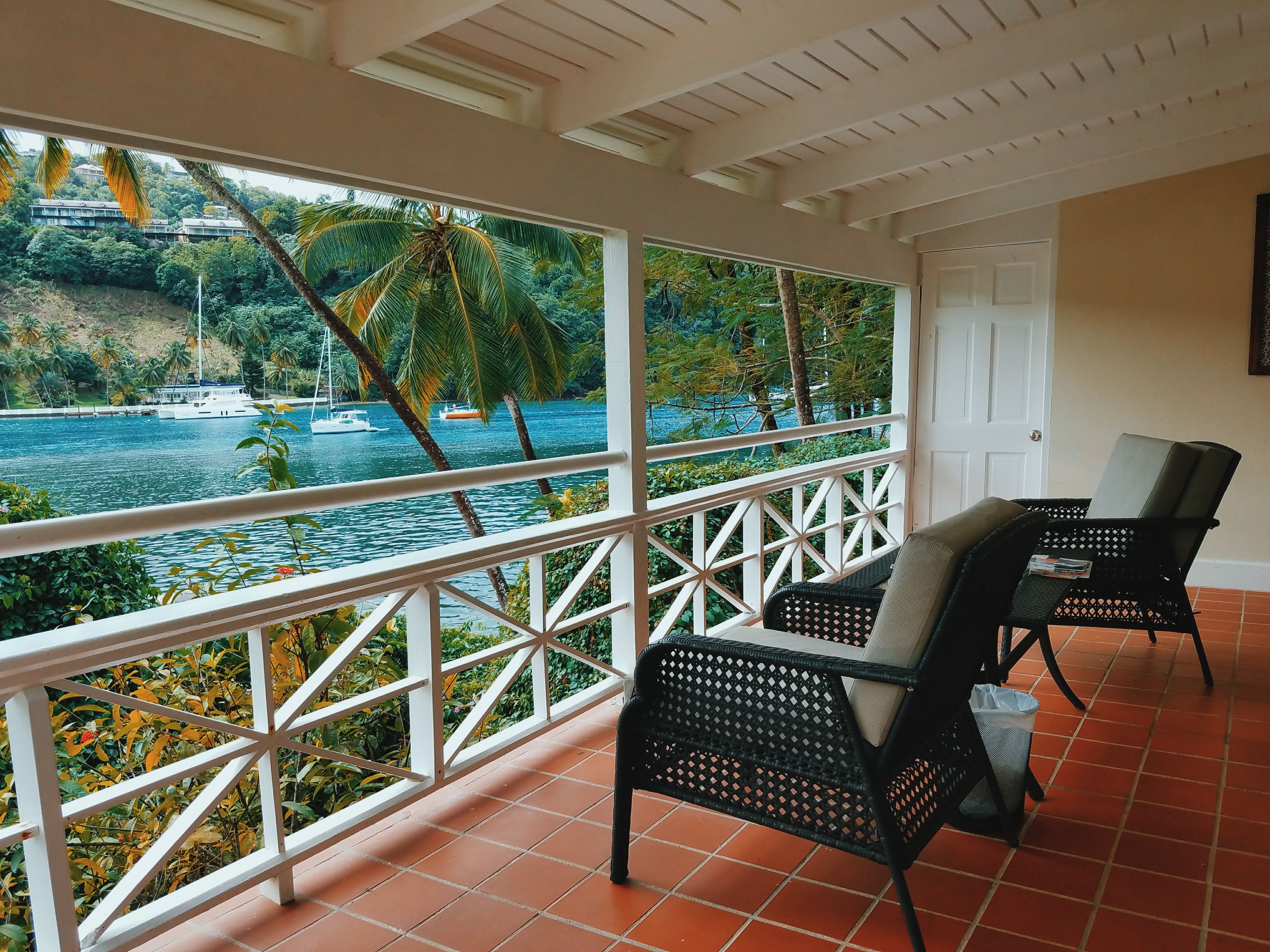 Scenic Ocean View Balcony with Cozy Seating · Free Stock Photo