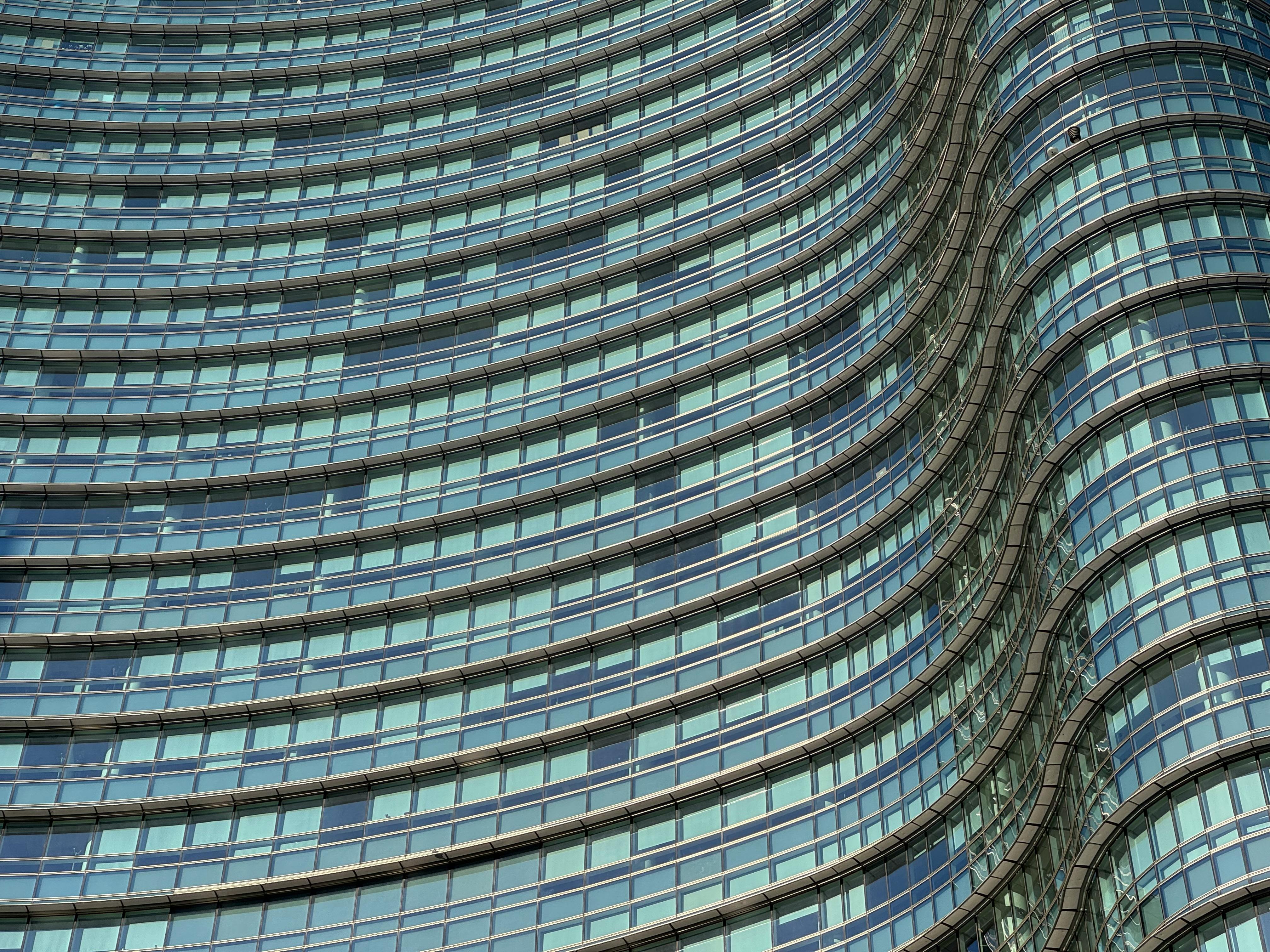 Curved Glass Facade of Modern Skyscraper · Free Stock Photo