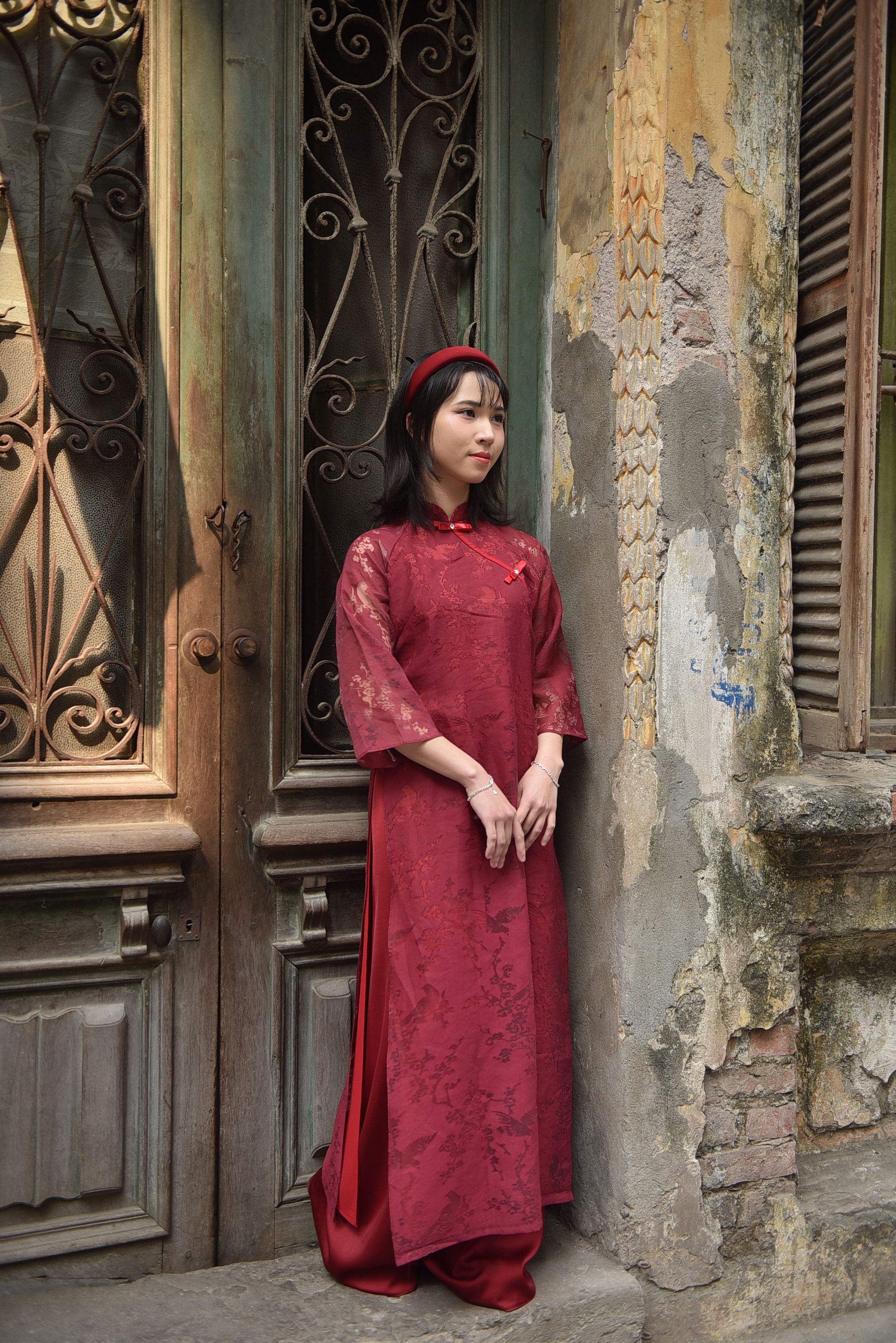 Young Woman in Traditional Red Dress by Rustic Door · Free Stock Photo