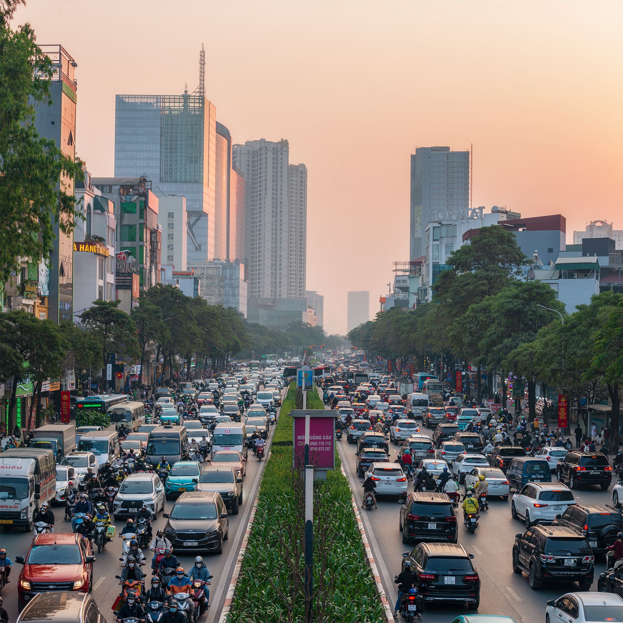 Busy Hanoi Street with Heavy Traffic at Dusk · Free Stock Photo
